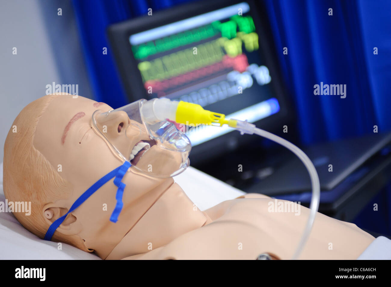 dummy patient simulated mannequin wearing oxygen mask in hospital bed ...