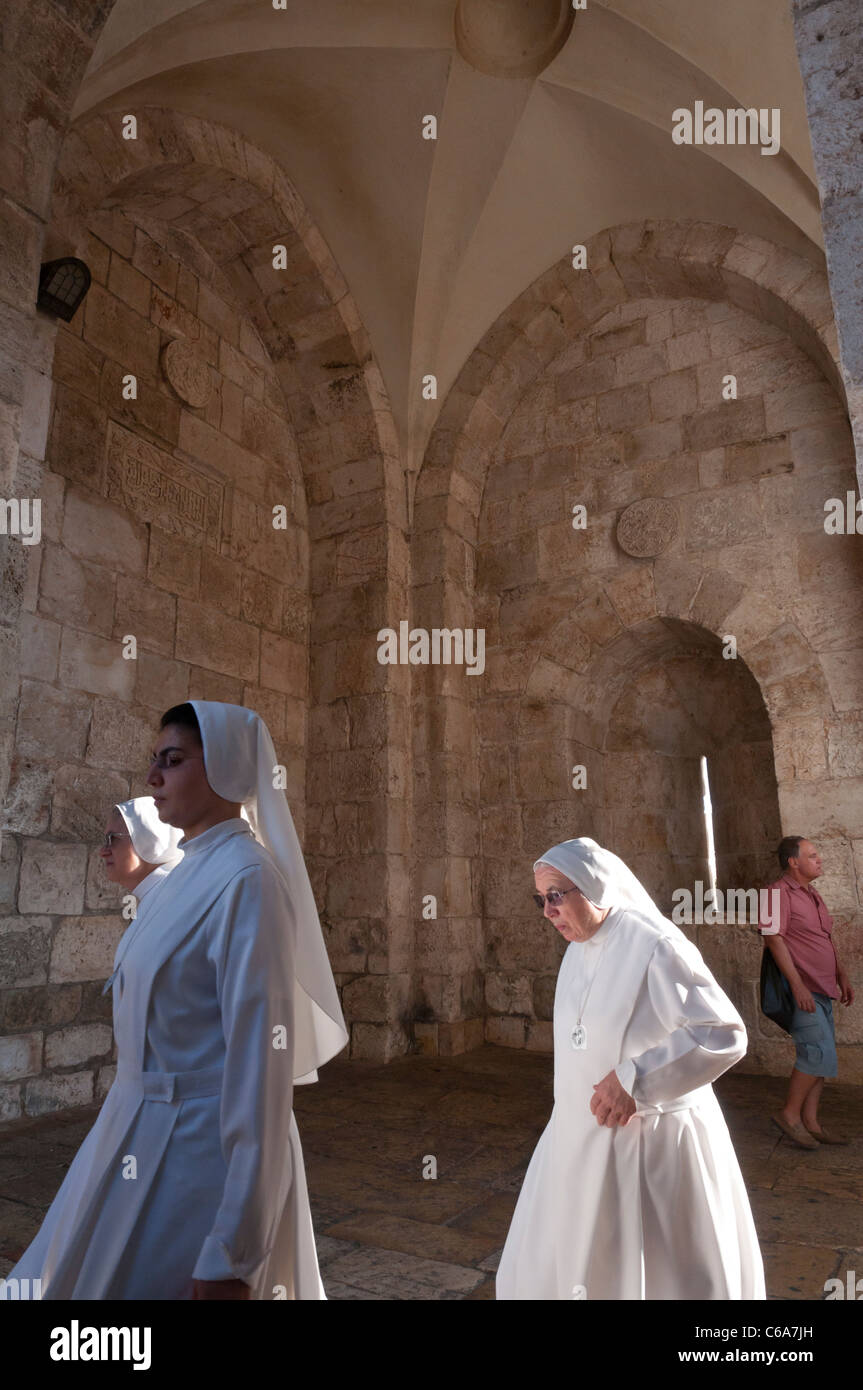 Catholic nuns wearing white walking across Jaffa Gate. Jerusalem Old ...