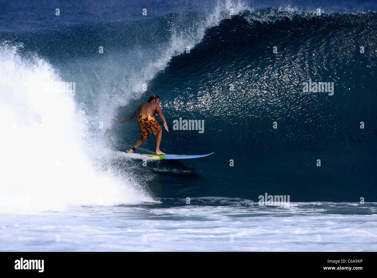 Surfer riding a wave known as Turtles in West Java, Indonesia Stock ...