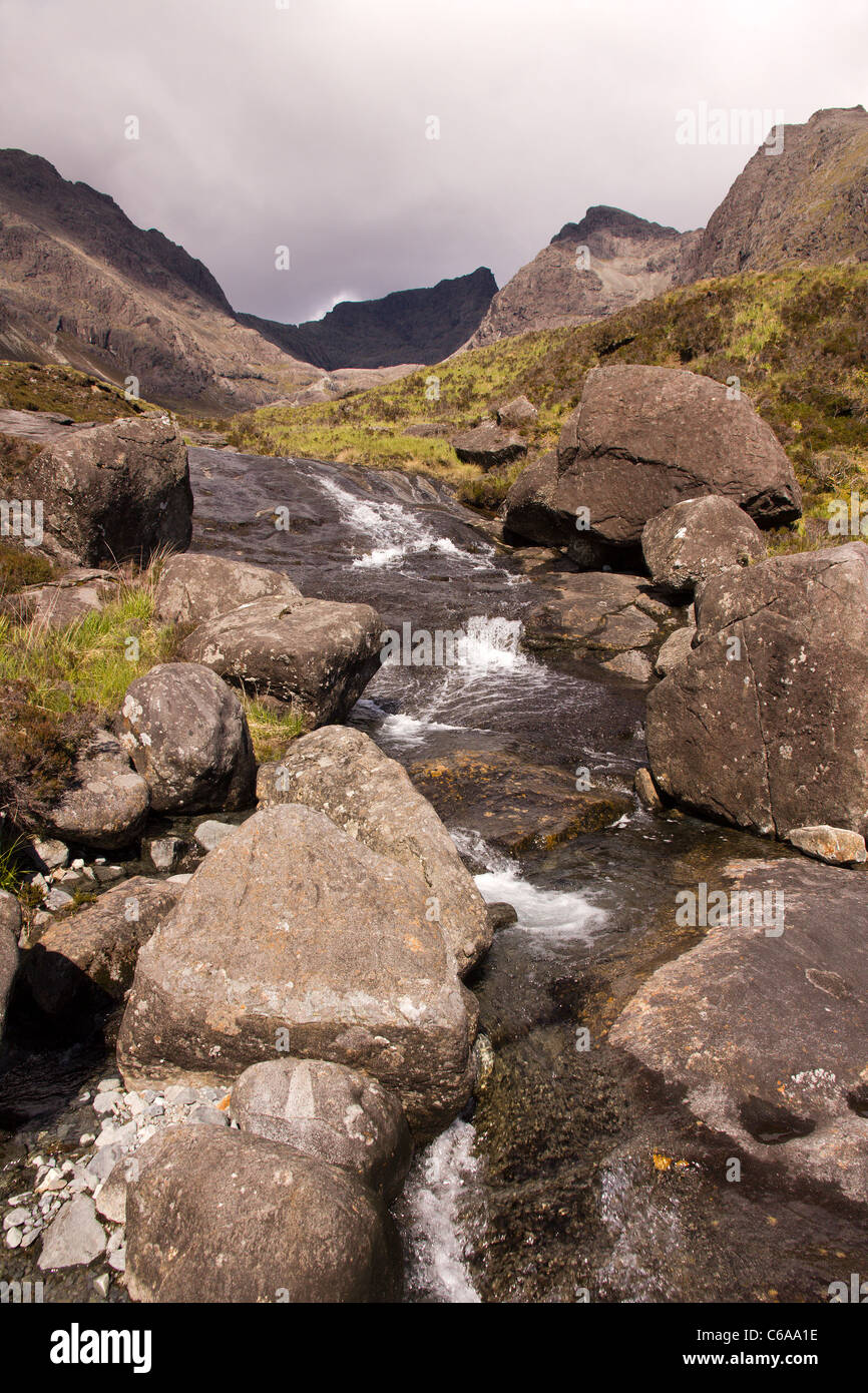 Tumbling mountain stream with the corrie of Coire Lagan in the Black ...