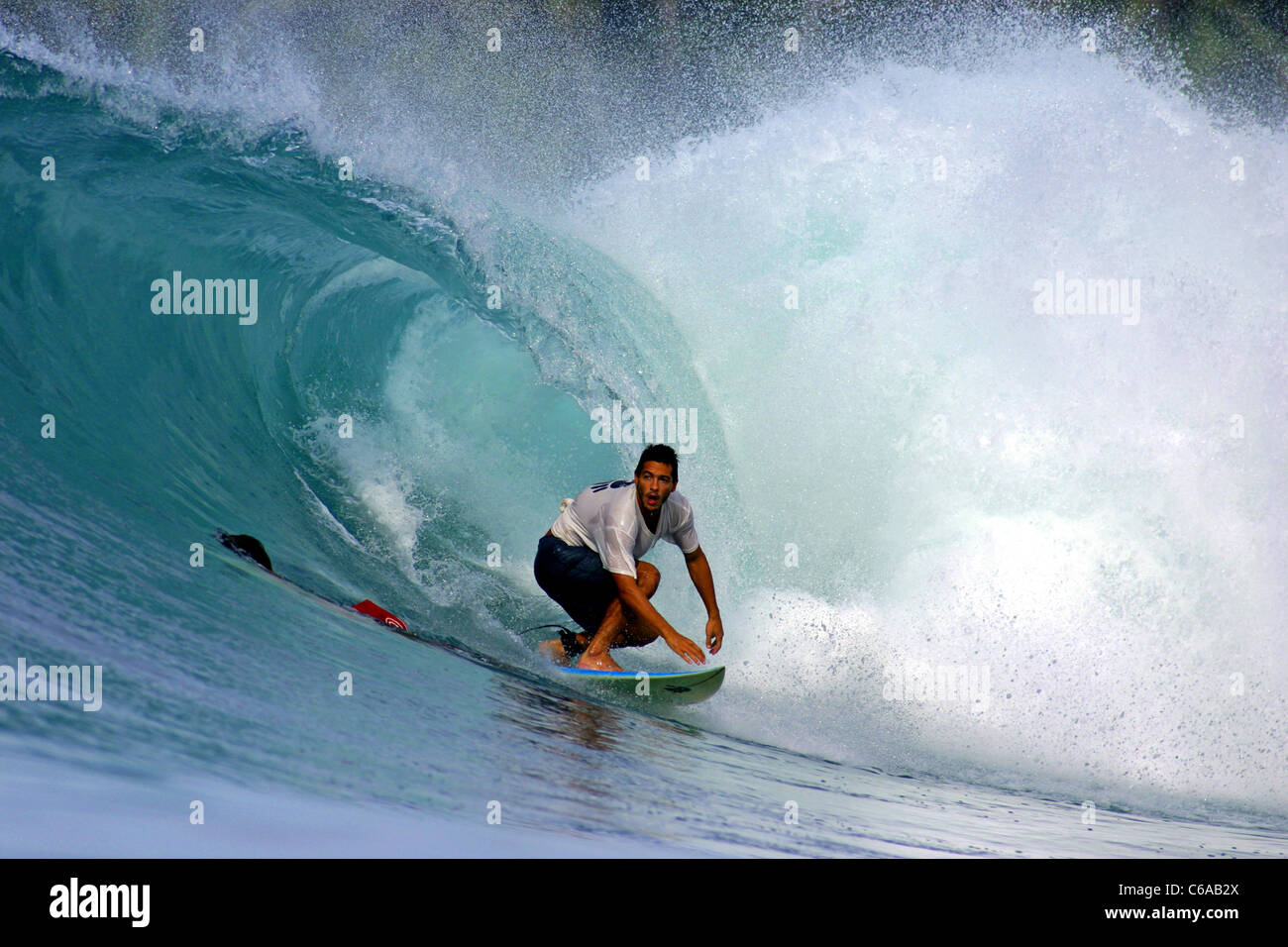 Surfing the point at Lagundri Bay on Nias Island, Sumatra, Indonesia ...
