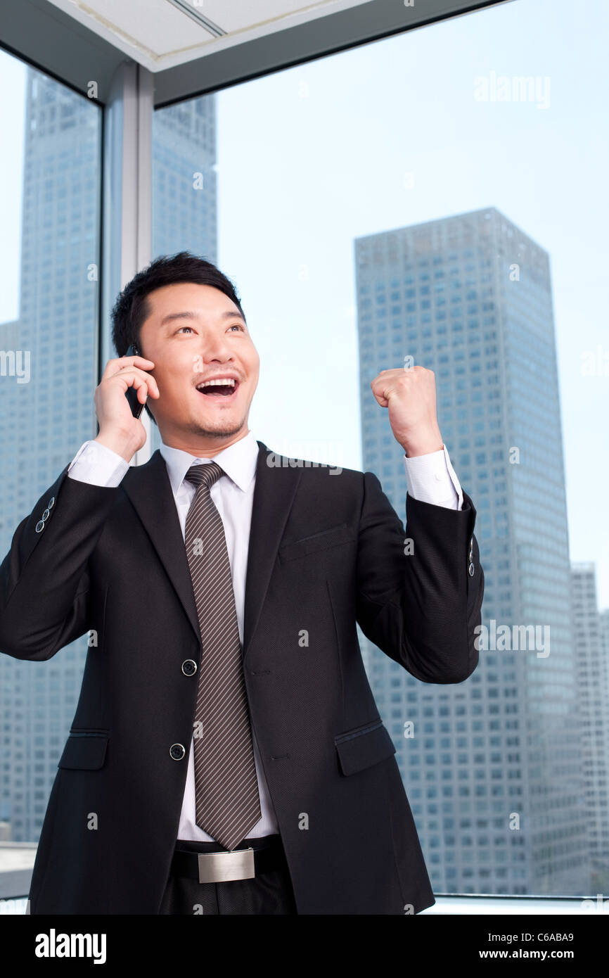 Businessman using mobile phone Stock Photo - Alamy