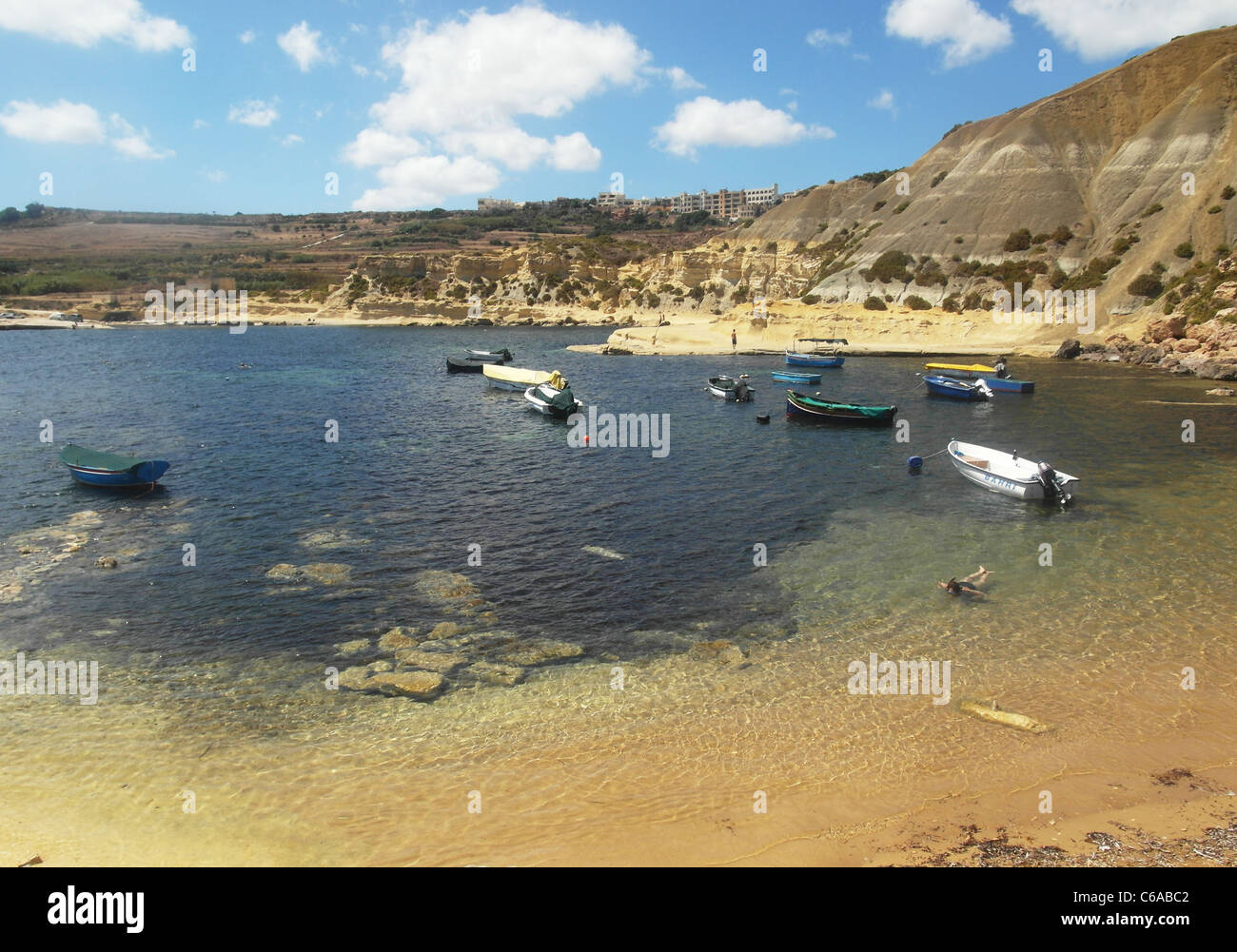 ix-Xatt l-Ahmar bay, near Mgarr, Gozo, Malta with boats Stock Photo - Alamy