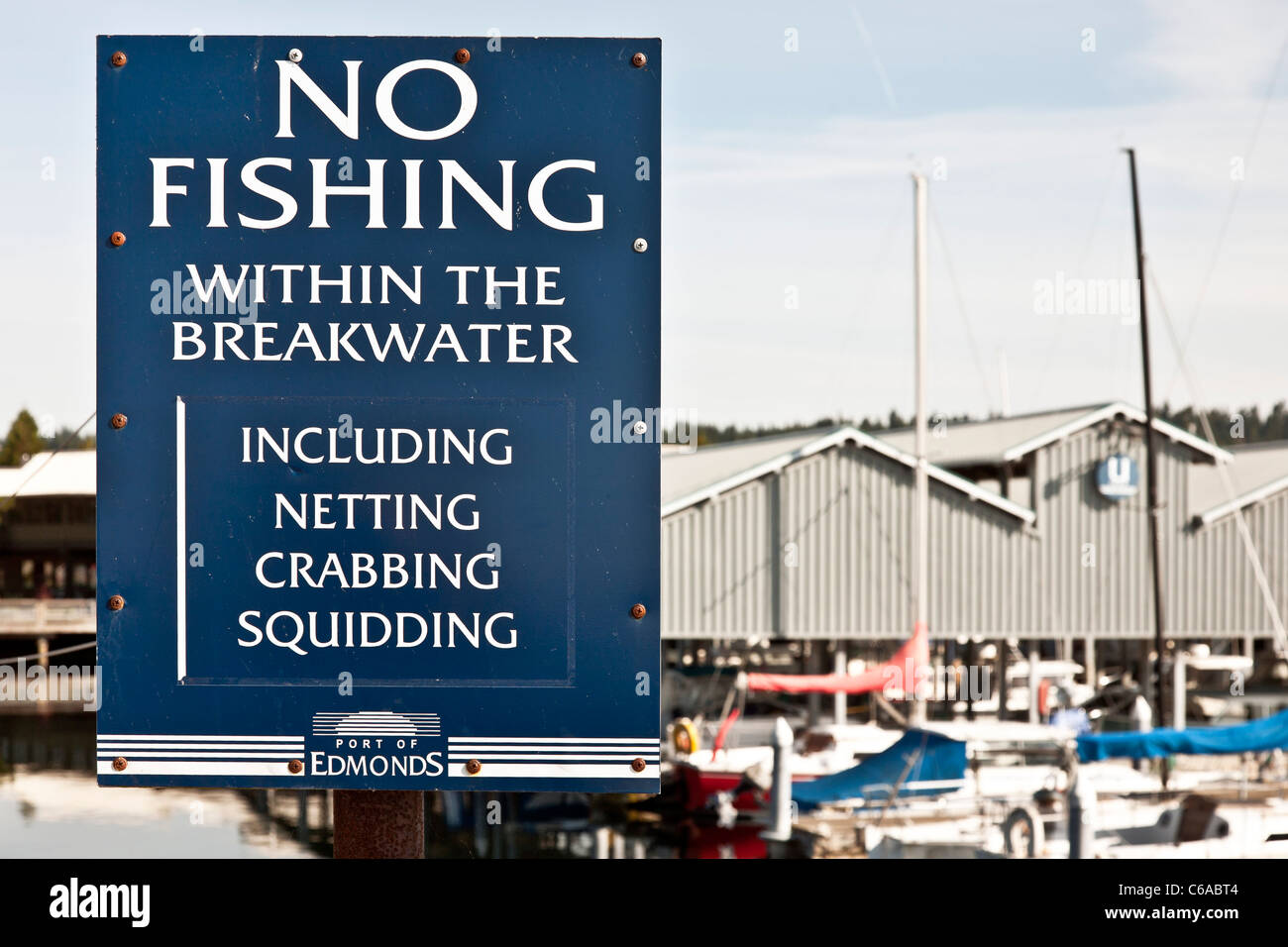 large blue & white posted public sign forbidding fishing netting ... large blue & white posted public sign forbidding fishing netting ...