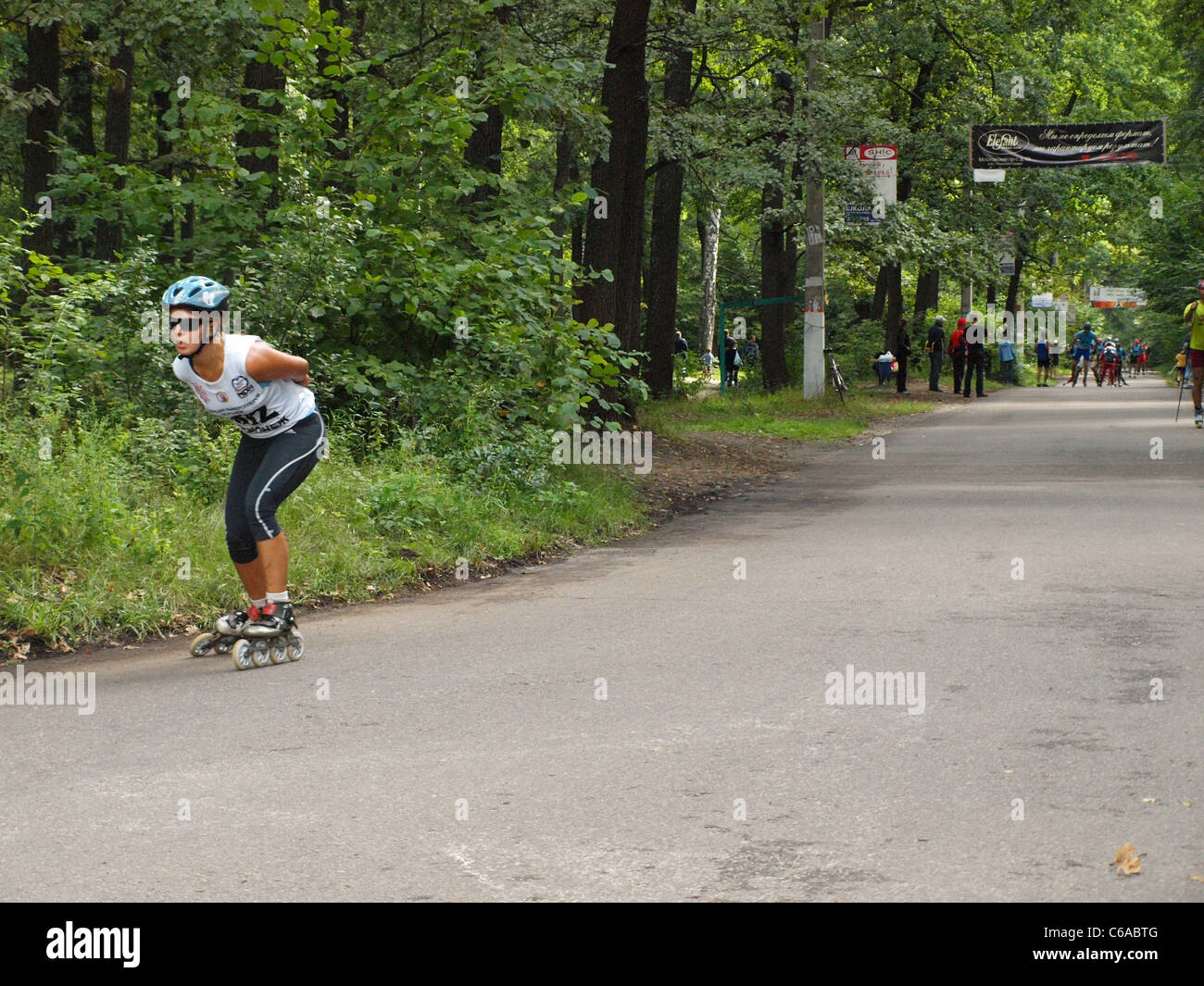 Young woman roller blading Stock Photo - Alamy