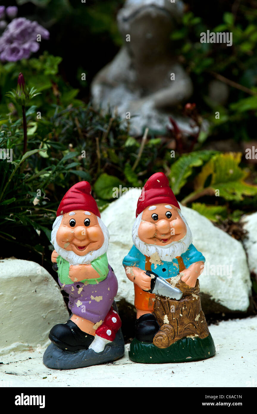 Two colourful gnomes in a garden Stock Photo - Alamy