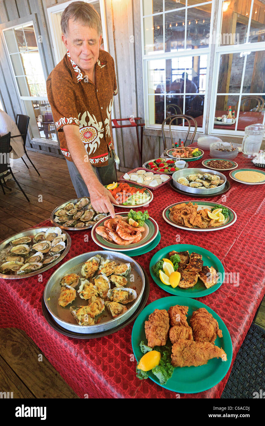 Larry Maddren, owner of Boss Oyster in Apalachicola, FL, displays some ...
