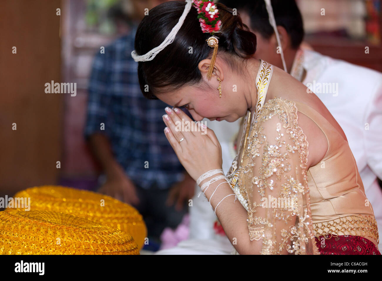thai bride praying during traditional wedding ceremony, uttaradit ...