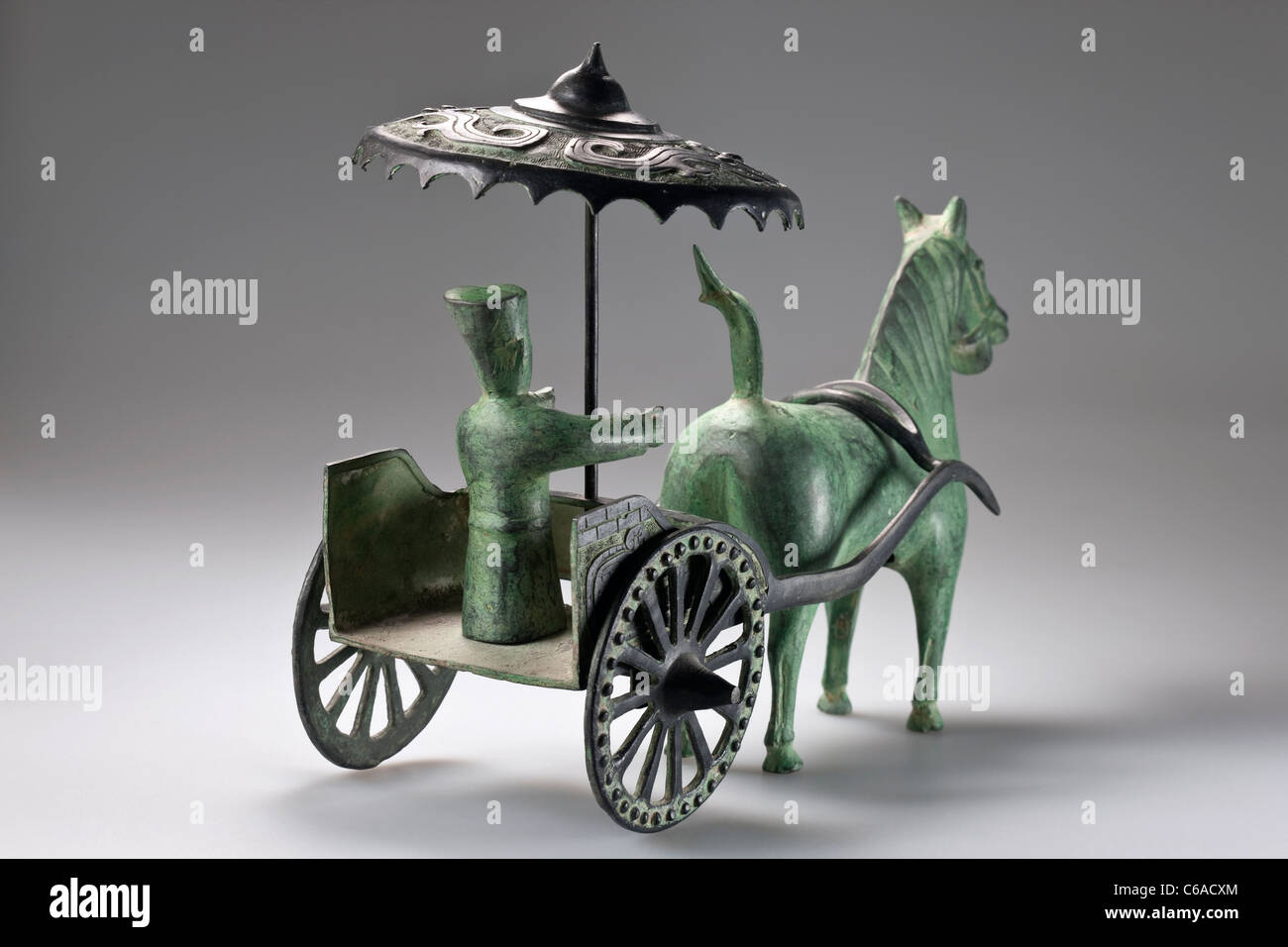 Chinese sculpture of a man riding a chariot Stock Photo - Alamy