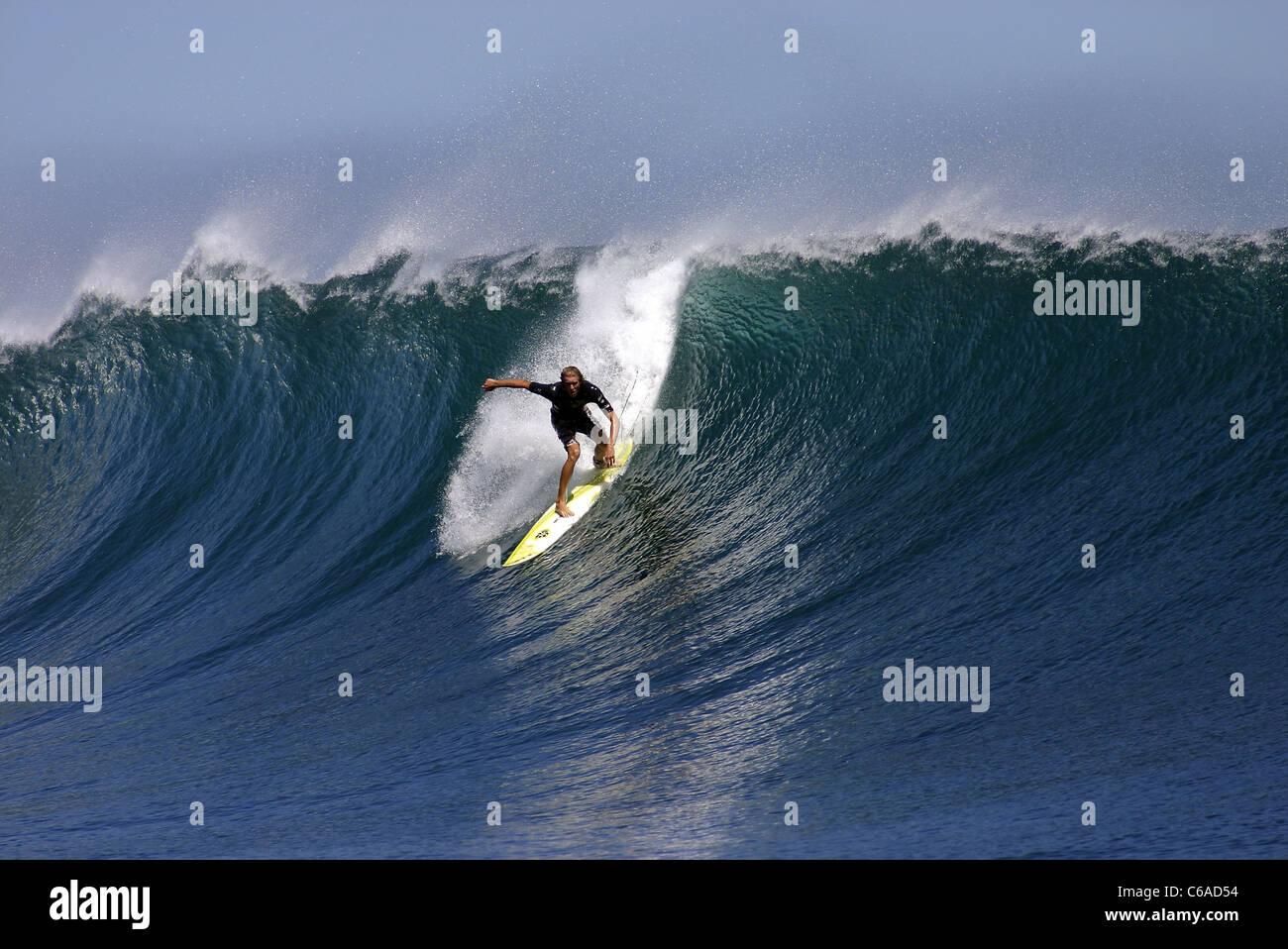 Surfer riding large wave at G-Land. Alas Purwo National Park, Grajagan ...