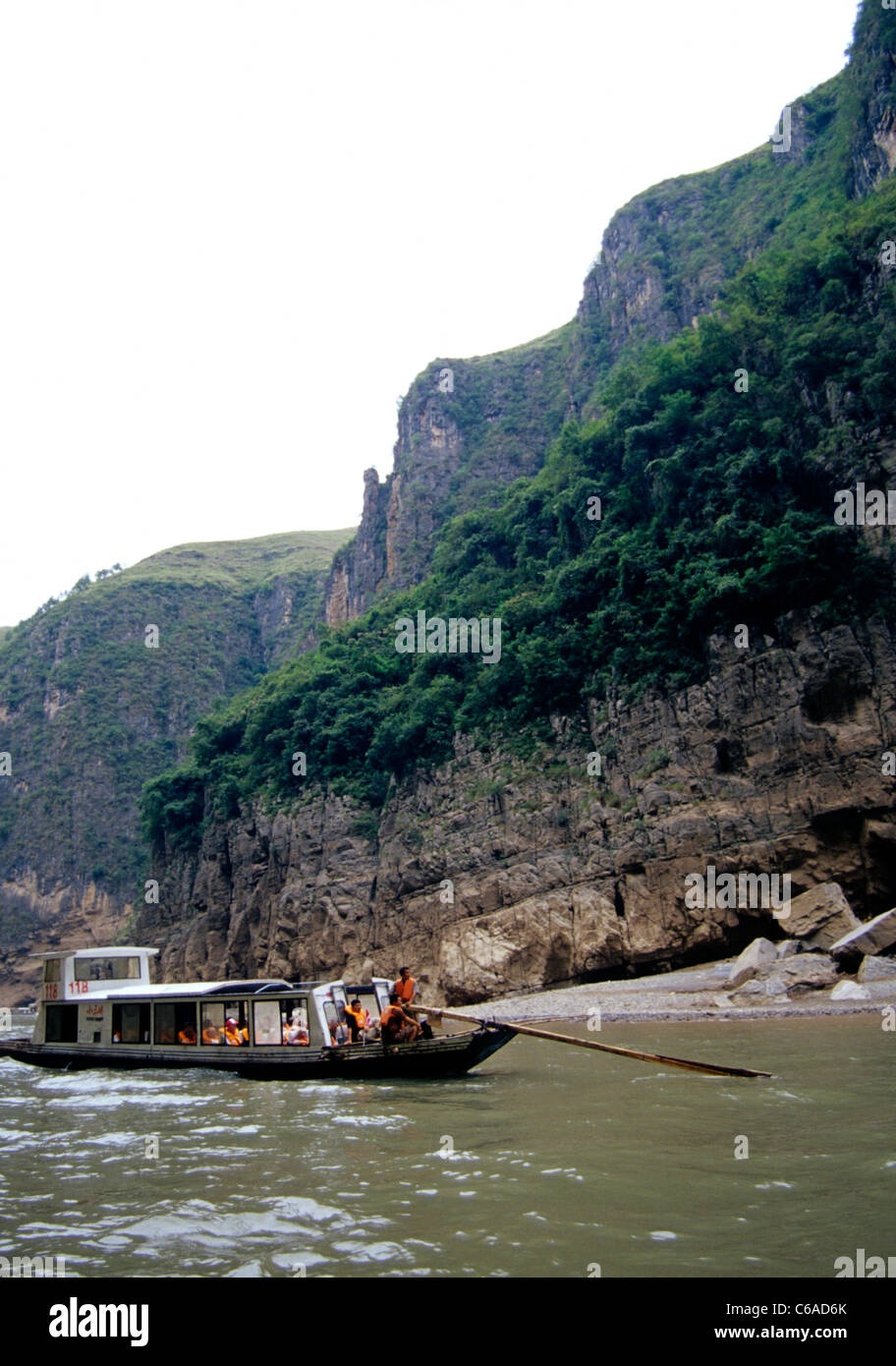boatmen guide tour boat on Danning river tributary of the Yangtze river ...