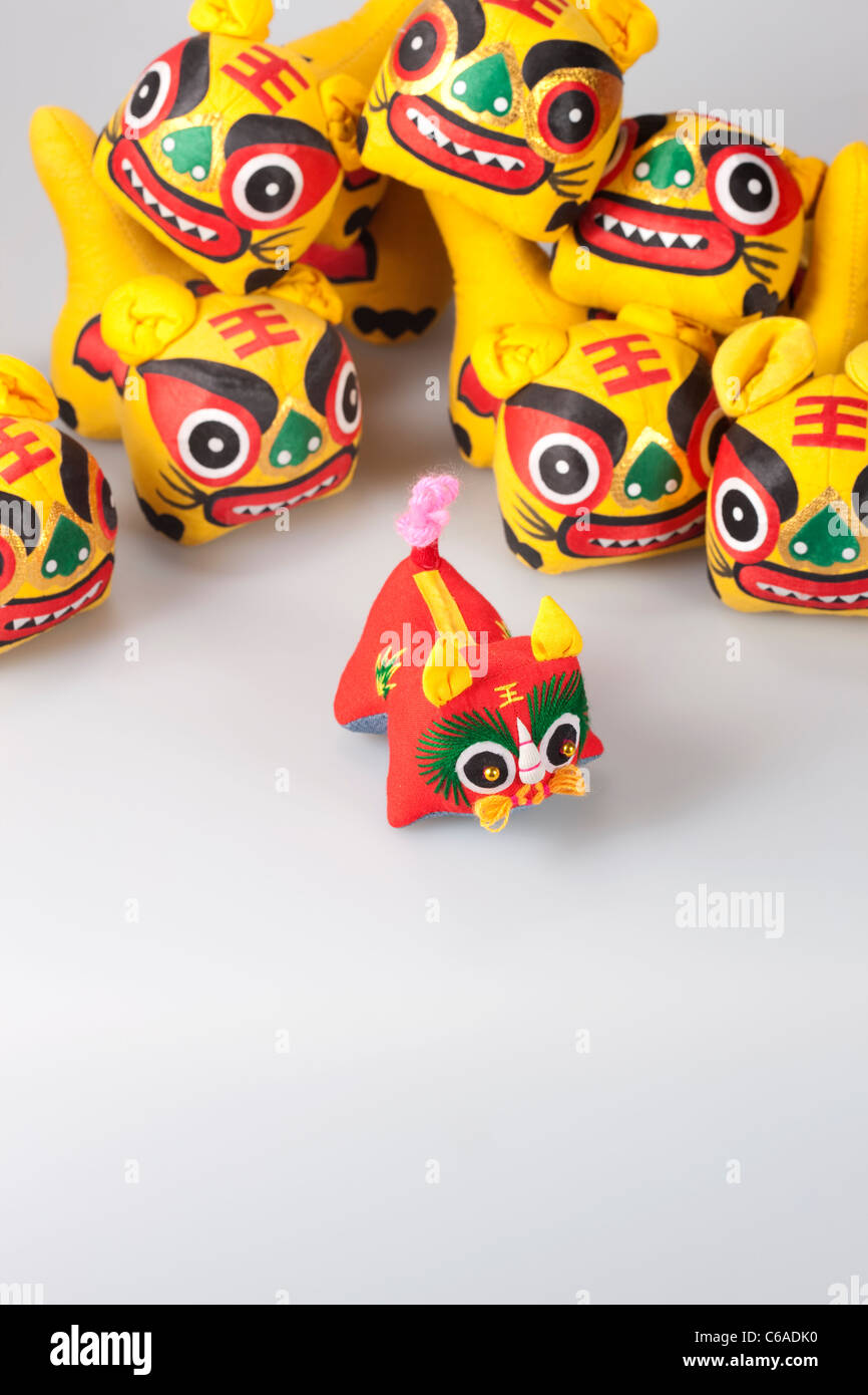 Chinese tiger stuffed animals in a heap Stock Photo - Alamy