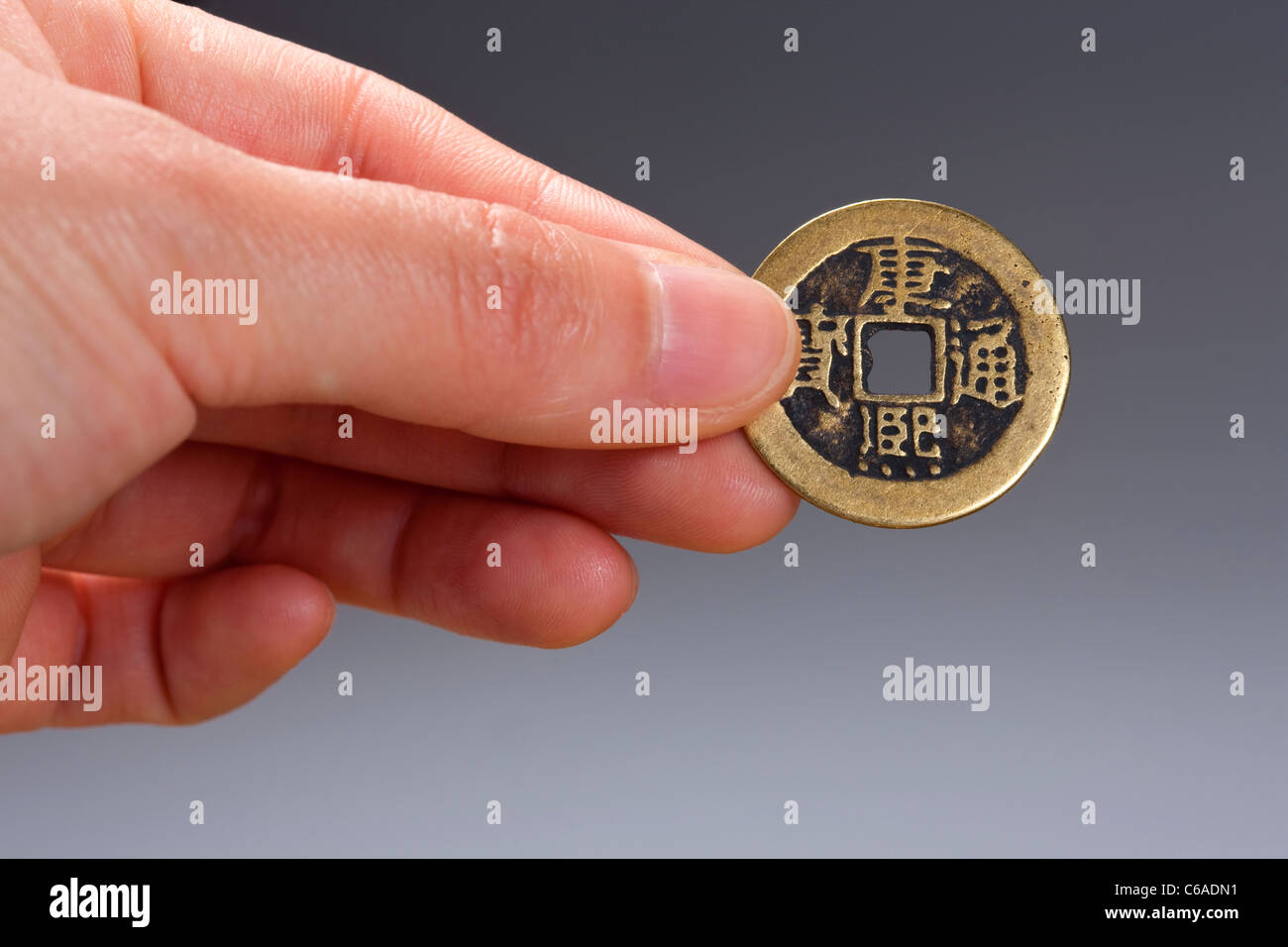 Chinese coin with hole hi-res stock photography and images - Alamy