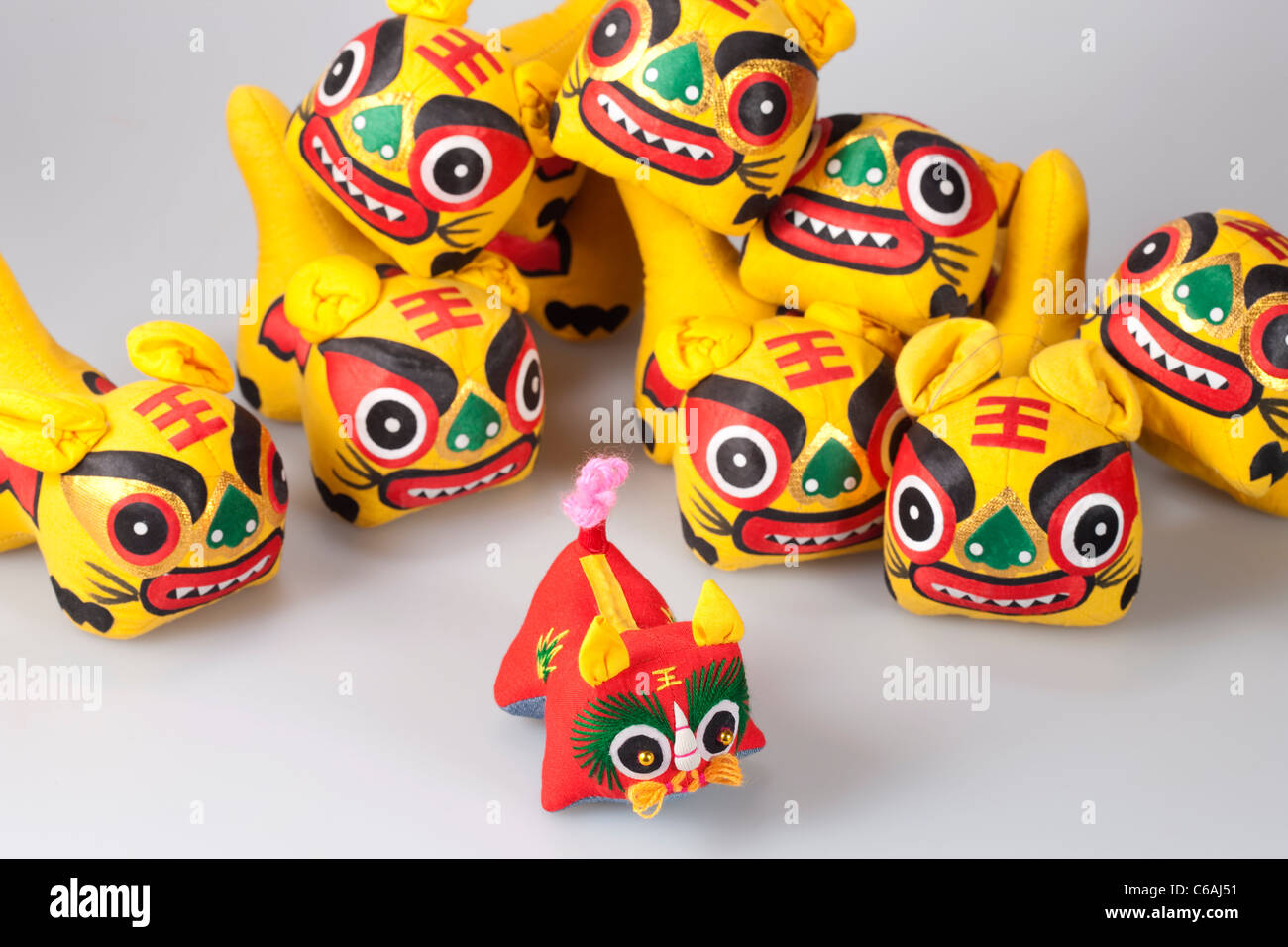 Chinese tiger stuffed animals in a heap Stock Photo - Alamy