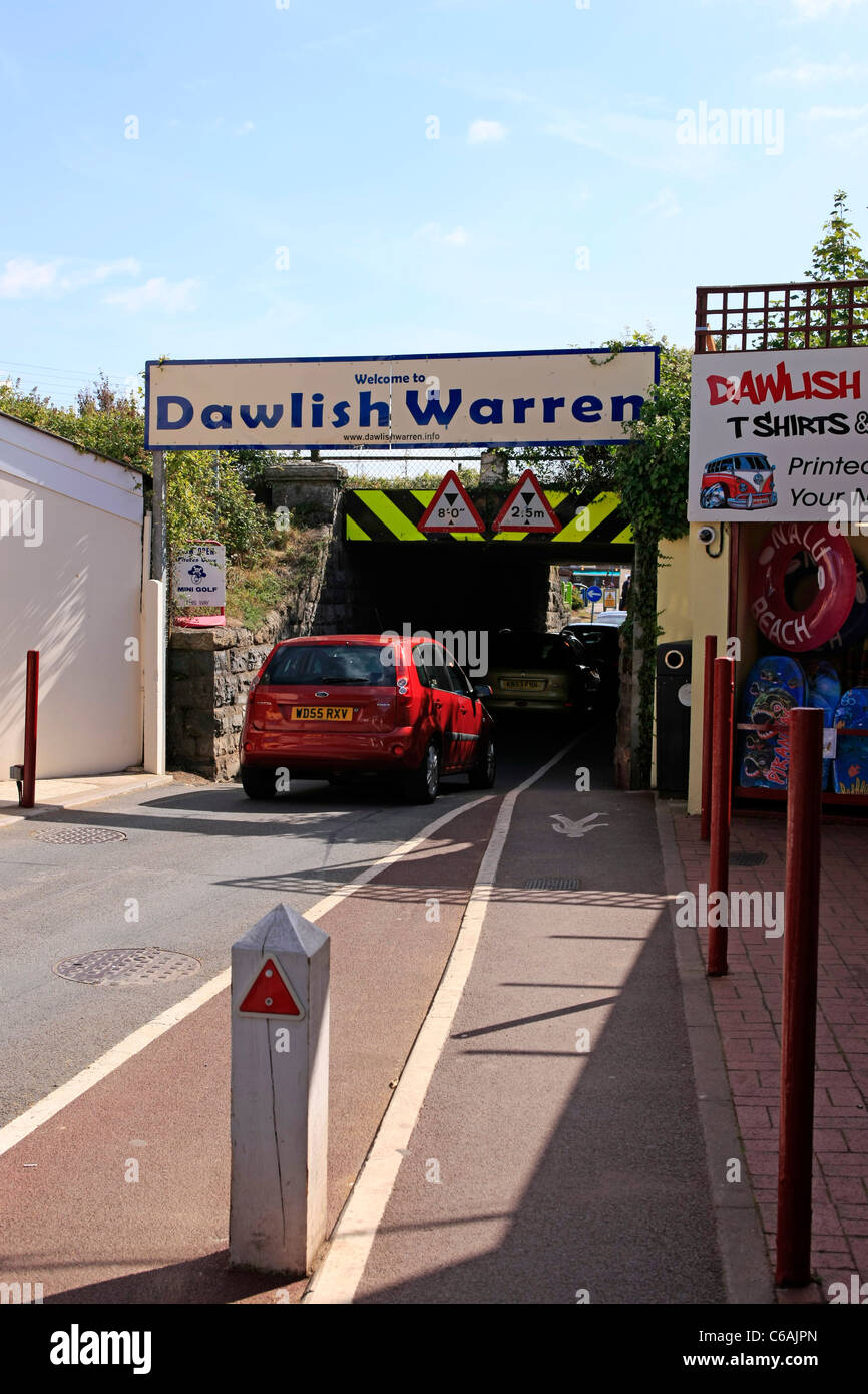 Welcome to Dawlish Warren in Devon sign above the low railway bridge ...