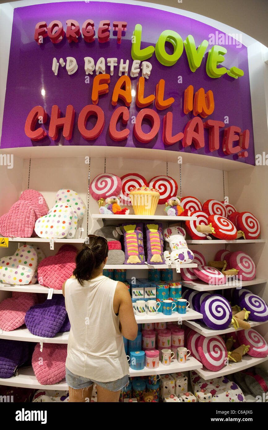 A girl buying chocolate in the Candylicious store, Sentosa Island ...