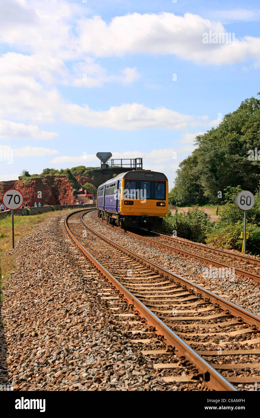Small Commuter train on the Dawlish seafront railway line in Devon ...