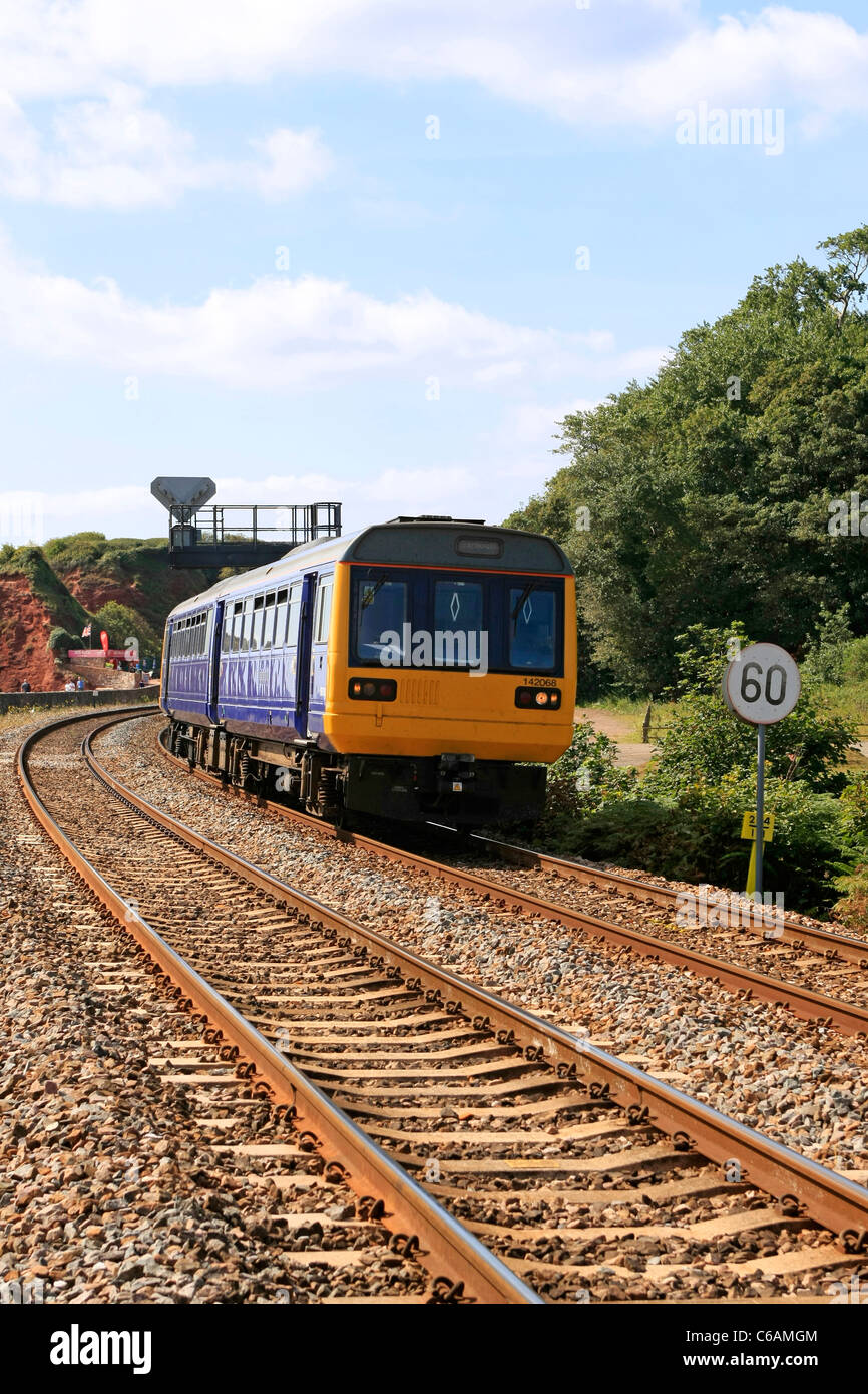 Small Commuter train on the Dawlish seafront railway line in Devon ...