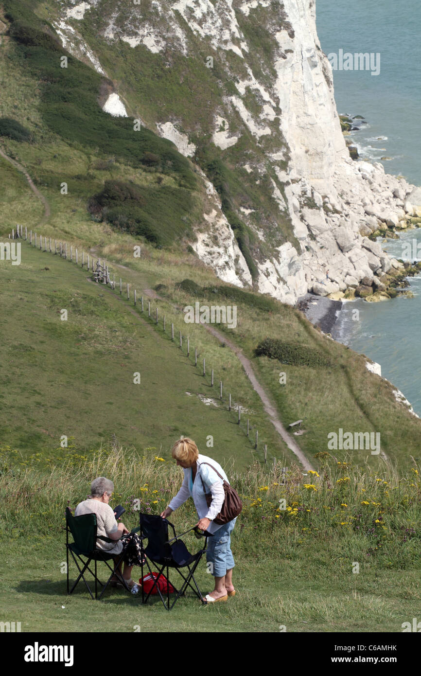 Walkers trekking along the white cliffs of Dover coastal path. Kent ...