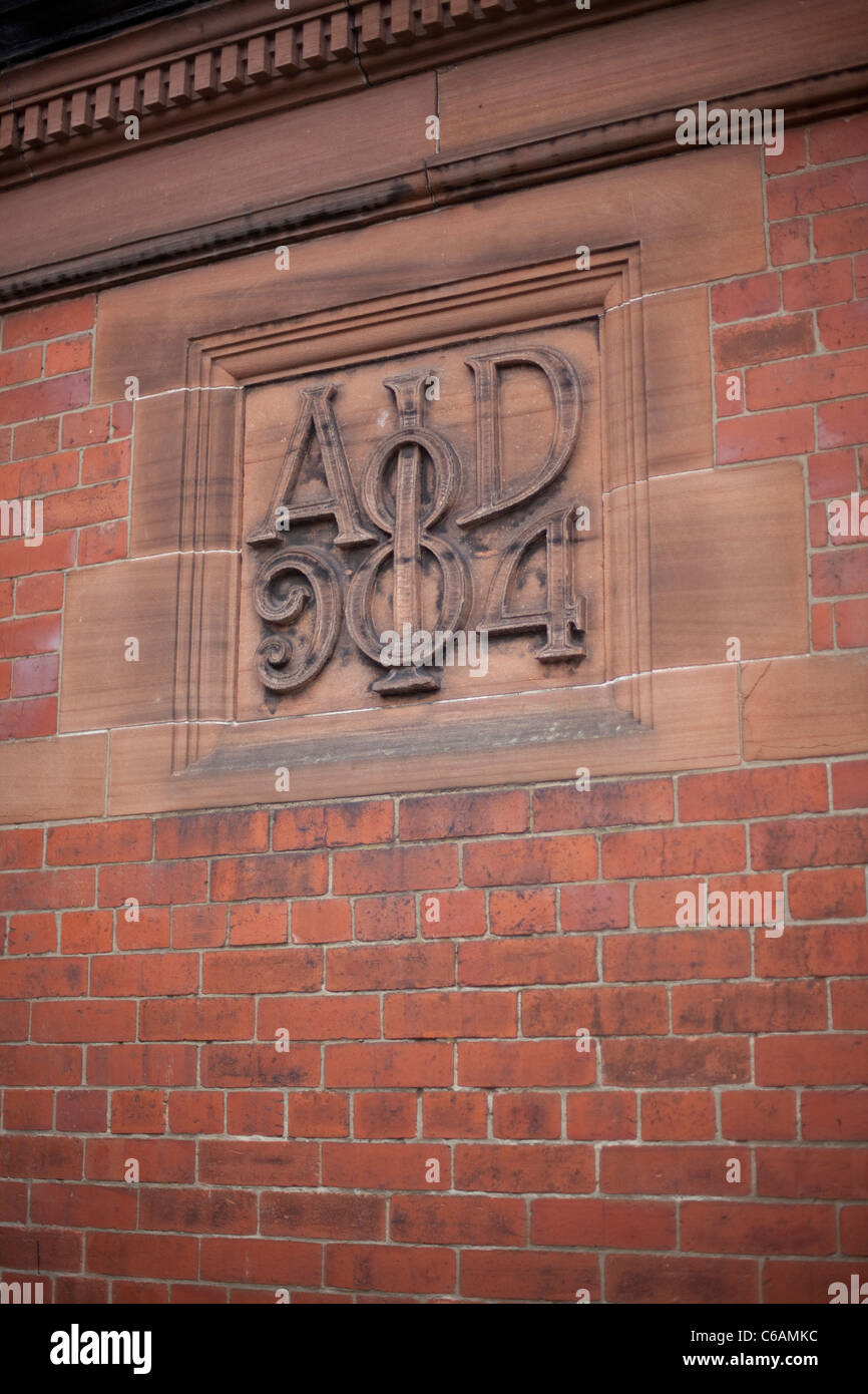 Red brick wall with date Stock Photo - Alamy
