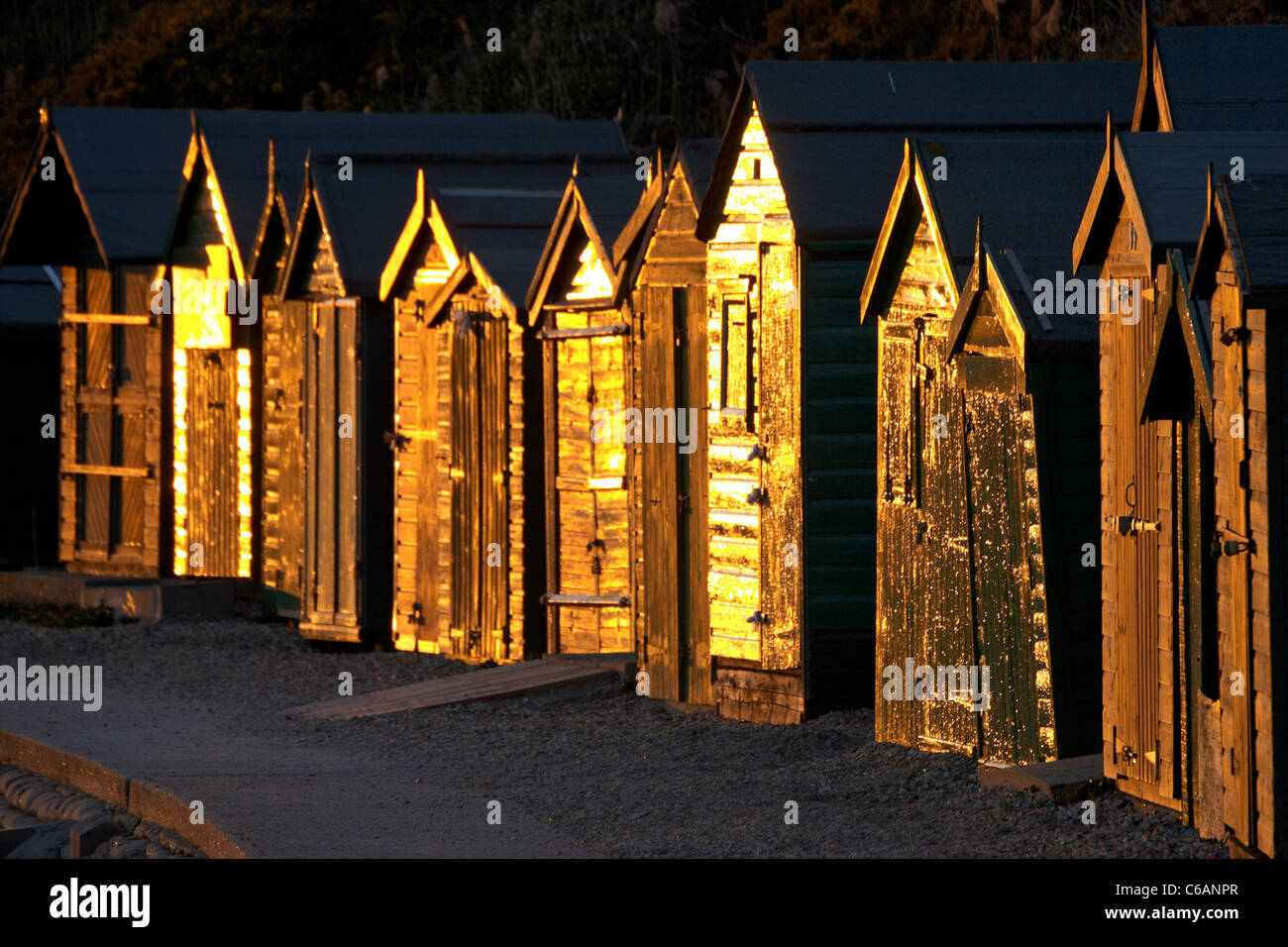 Beach huts at Hill Head, Hampshire pictured at sunset Stock Photo - Alamy