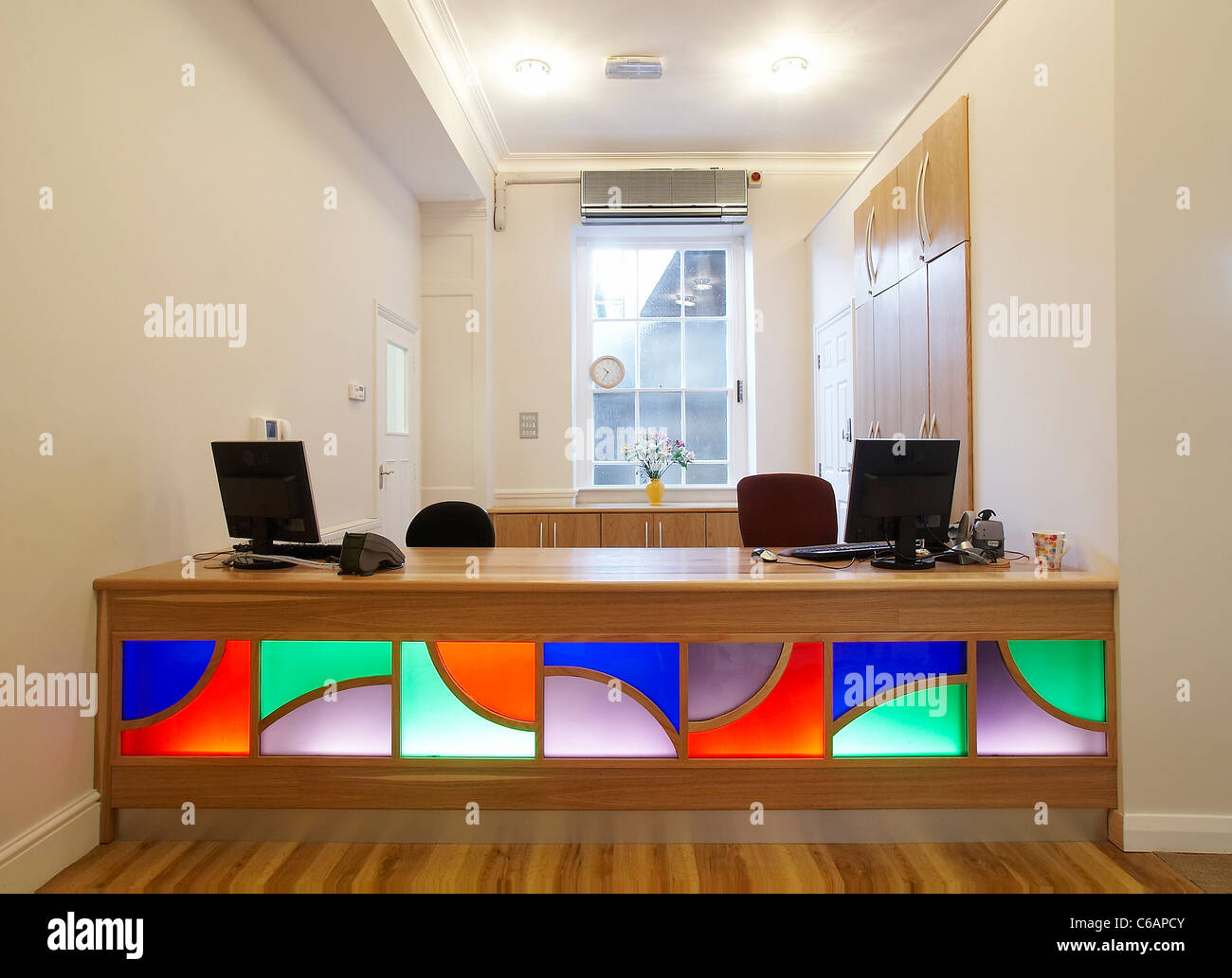 Empty reception desk at a dental surgery Stock Photo - Alamy