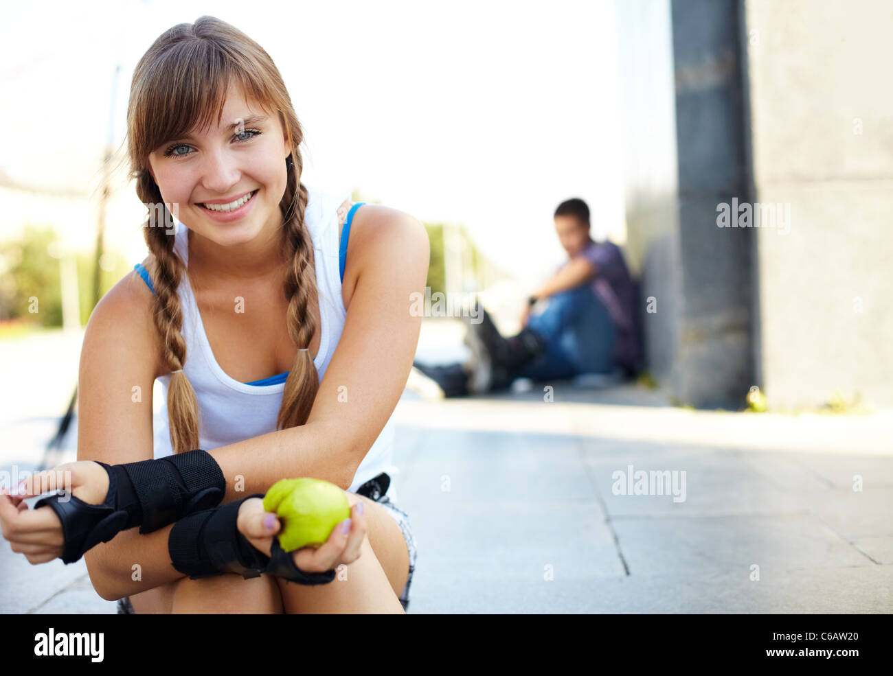 Cute teenage girl looking at camera in park Stock Photo - Alamy