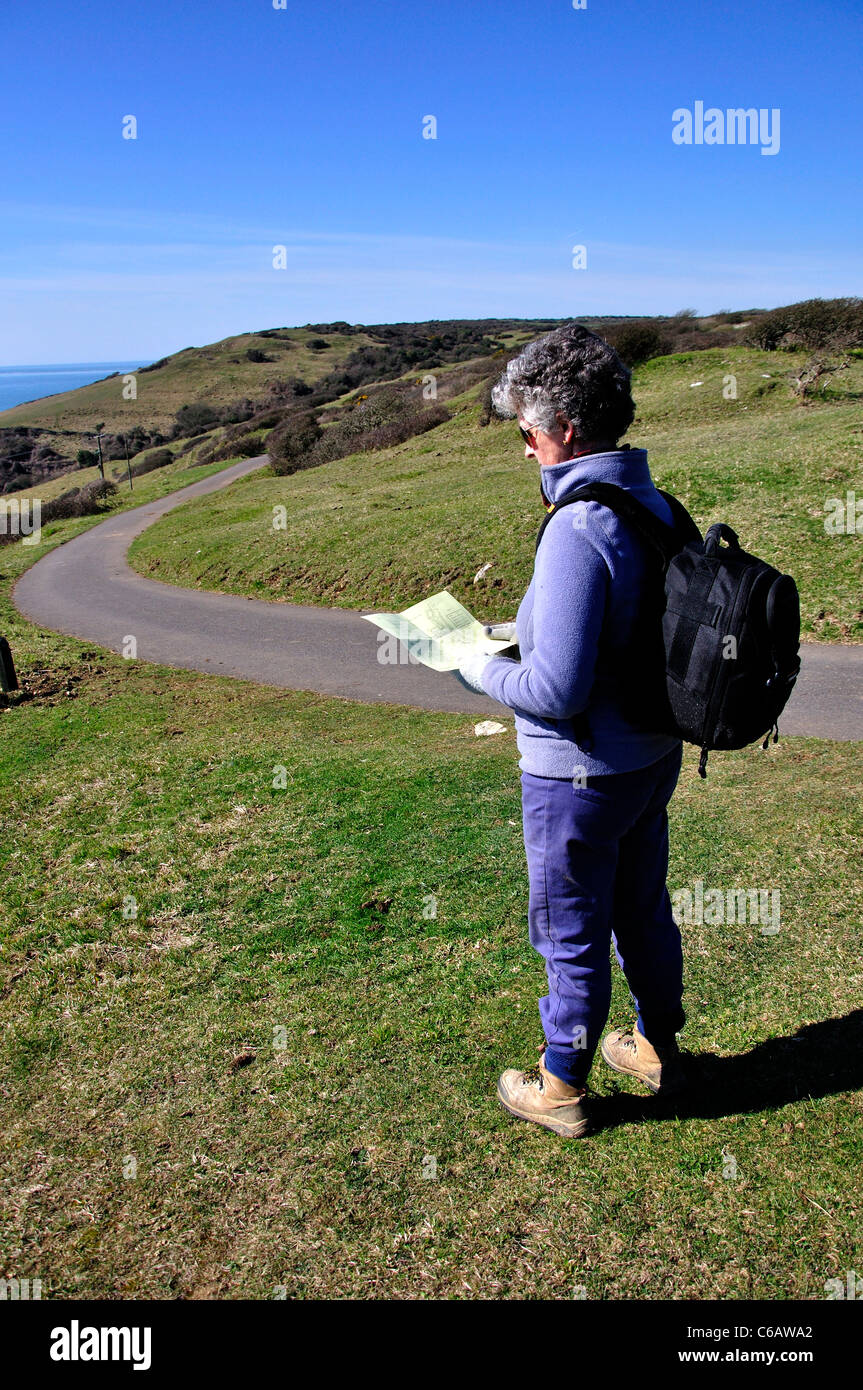 A walker reading a map at Durlston Country Park Dorset UK Stock Photo ...
