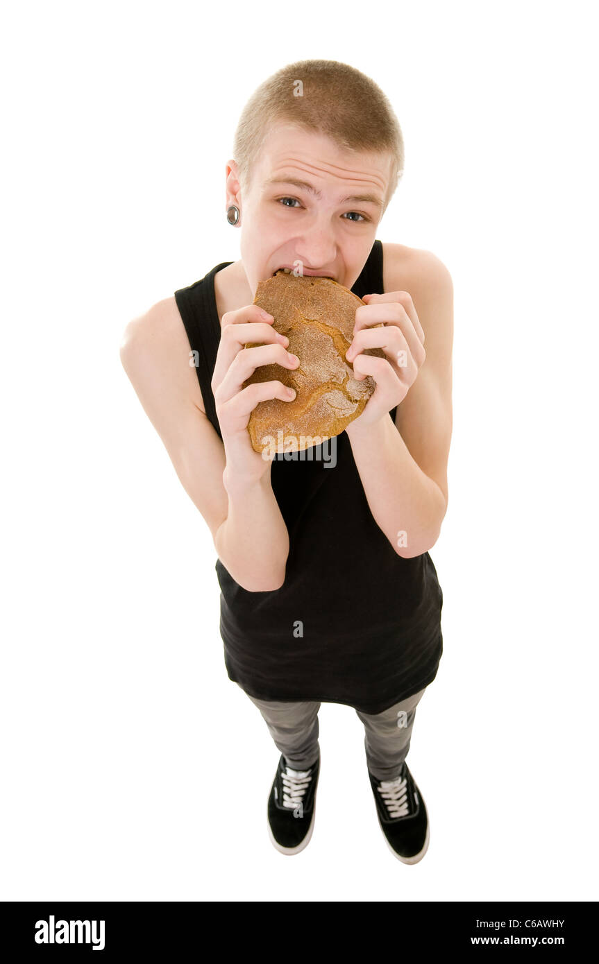 The hungry teenager eating a bread isolated on white background Stock ...