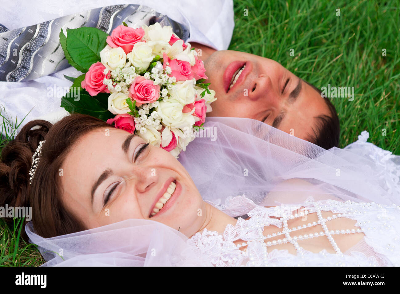 Happy smiling bride and groom Stock Photo - Alamy