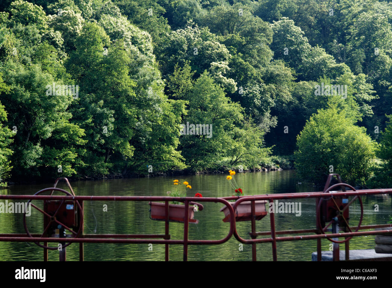 The river Mayenne, view from a lock, towpath of La Mayenne (Pays de la ...
