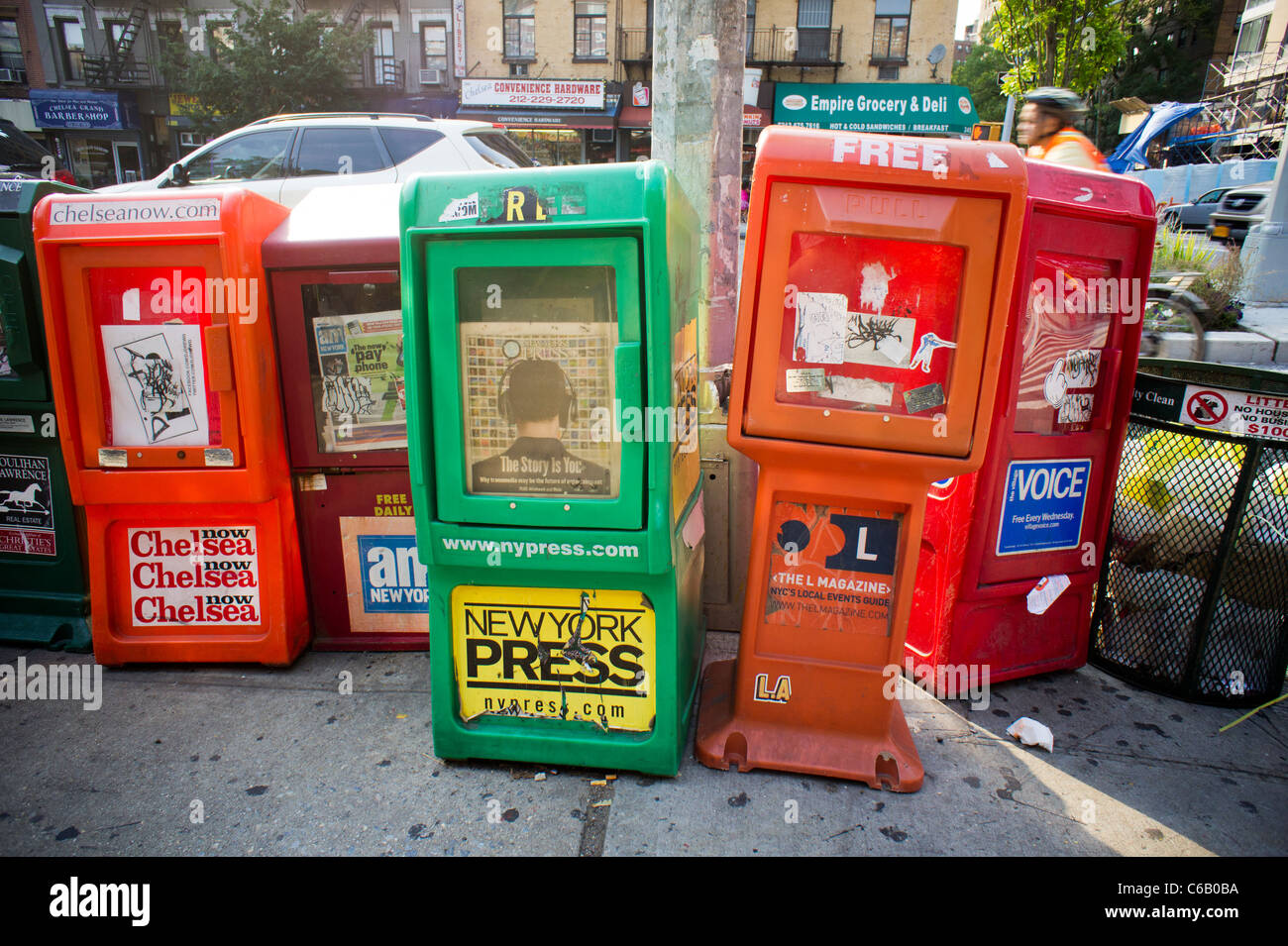 Newspaper boxes are seen on the sidewalk in the Chelsea neighborhood of ...
