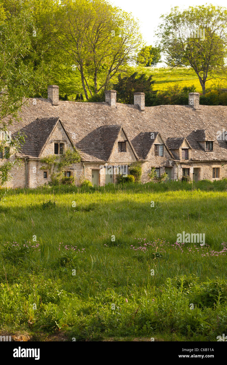 Evening sunlight falling on Arlington Row in the Cotswold village of ...