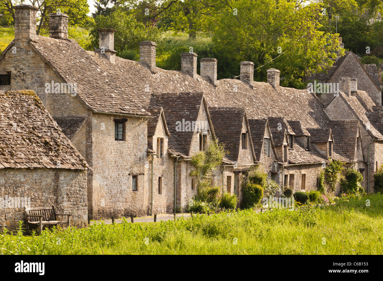 Evening sunlight falling on Arlington Row in the Cotswold village of ...