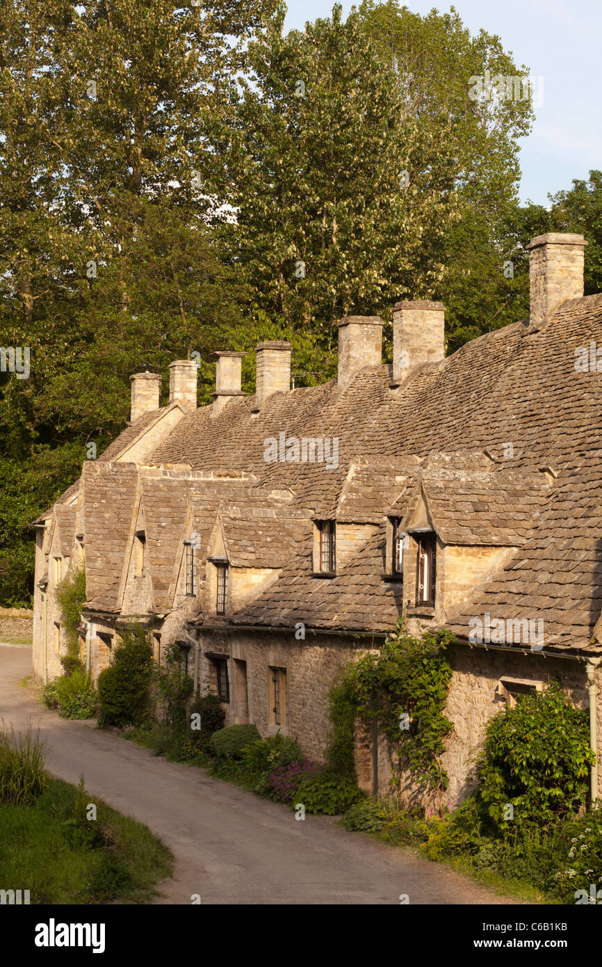 Evening sunlight falling on Arlington Row in the Cotswold village of ...