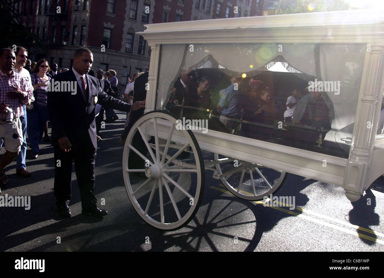 Hundreds of family, fans and supporters walk in the funeral procession ...