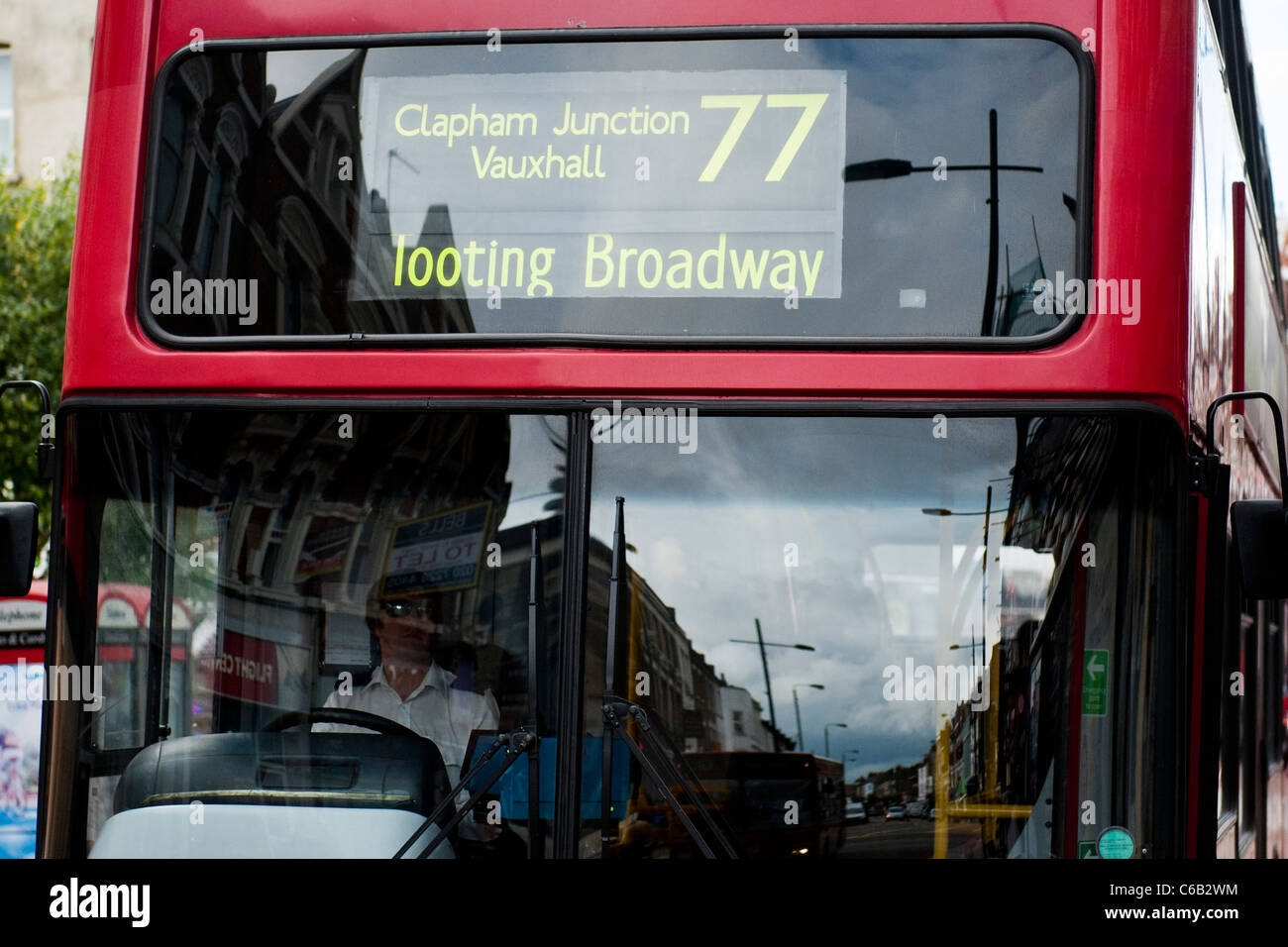 In the aftermath of the looting at Clapham Junction a passing bus ...