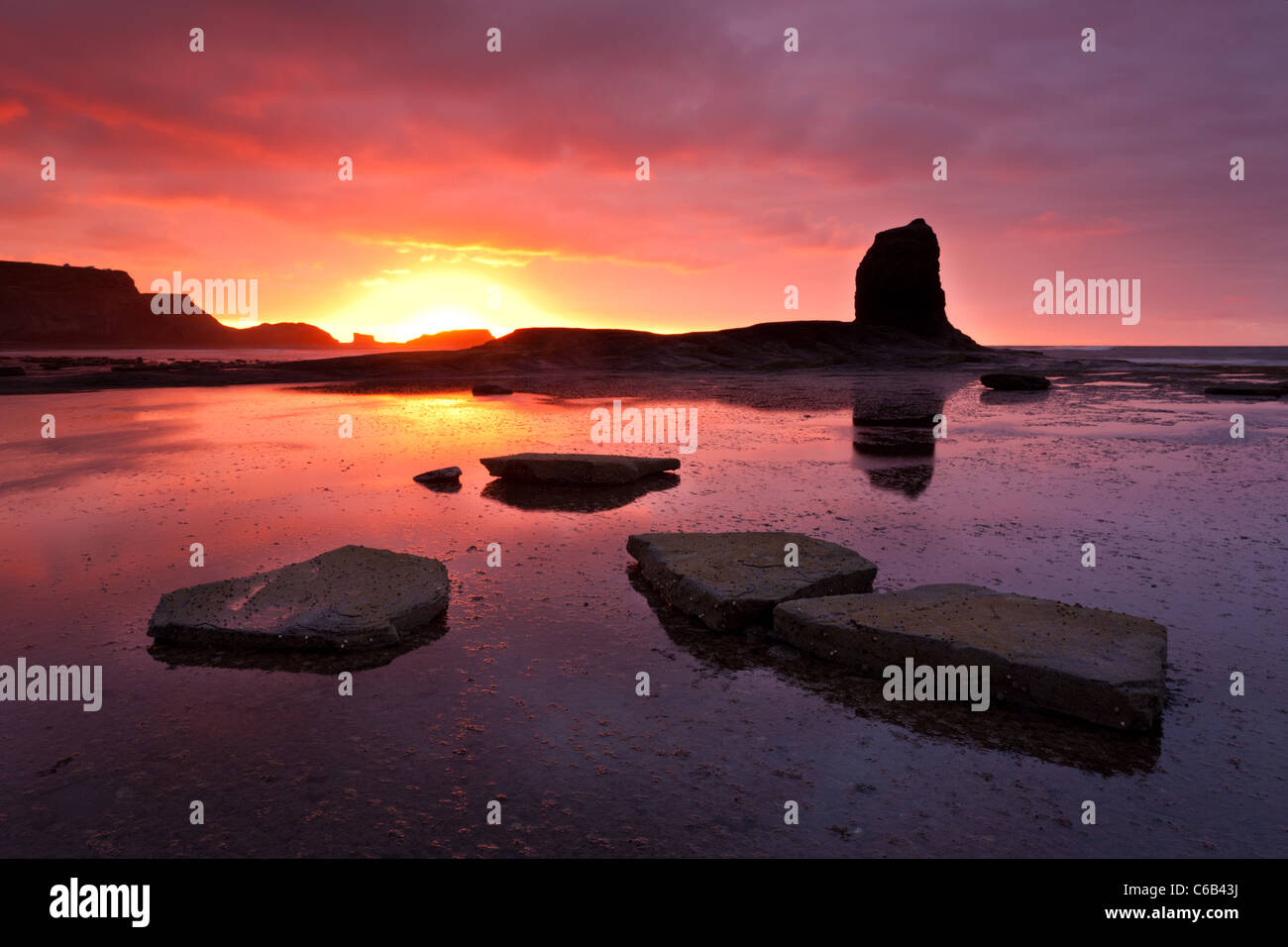 Sunset and Black Nab Sea Stack, Saltwick Bay, Whitby, North Yorkshire ...
