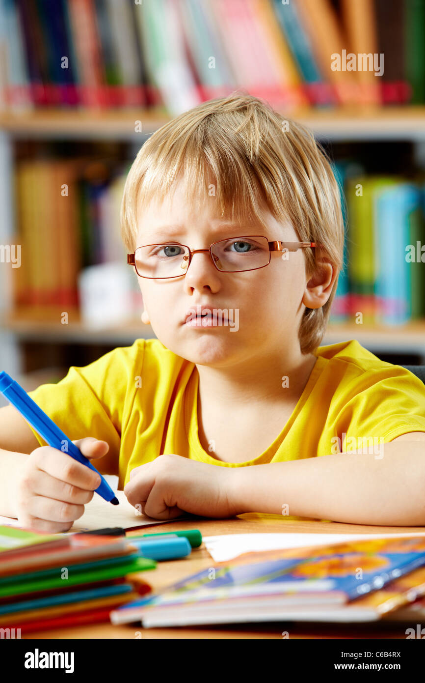 Portrait of clever boy drawing with highlighters Stock Photo - Alamy