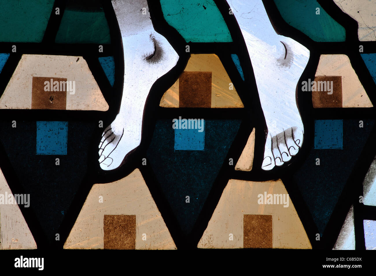 Feet detail of stained glass in St. John the Baptist Church, Billesdon ...