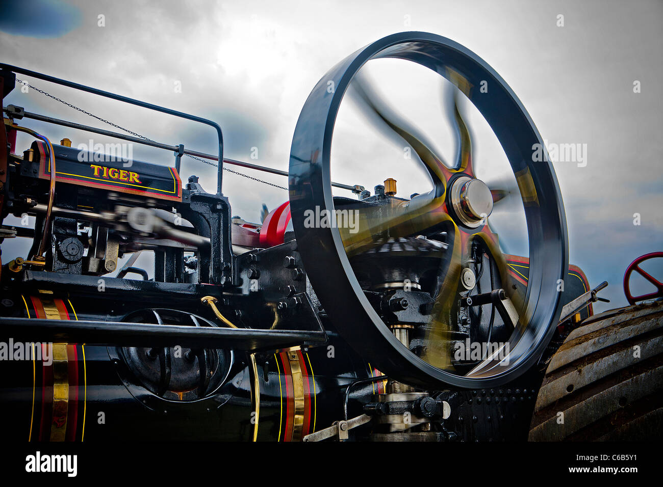 Flywheel of a steam engine shown spinning Stock Photo - Alamy