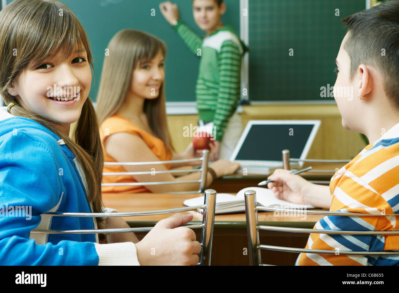 Confident student looking at camera during lesson Stock Photo - Alamy