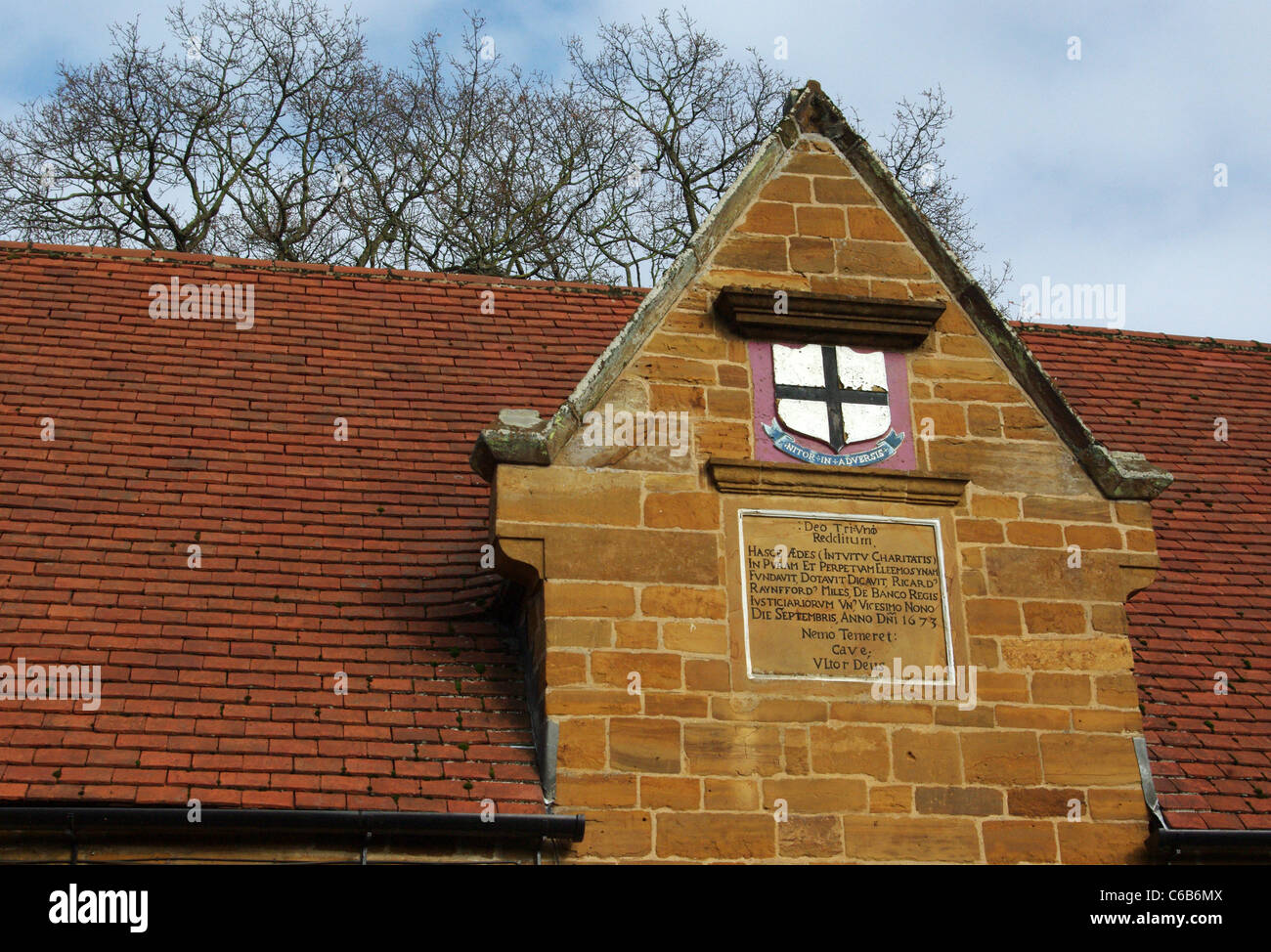 Inscription above a row of almshouses, Dallington village, UK Stock ...