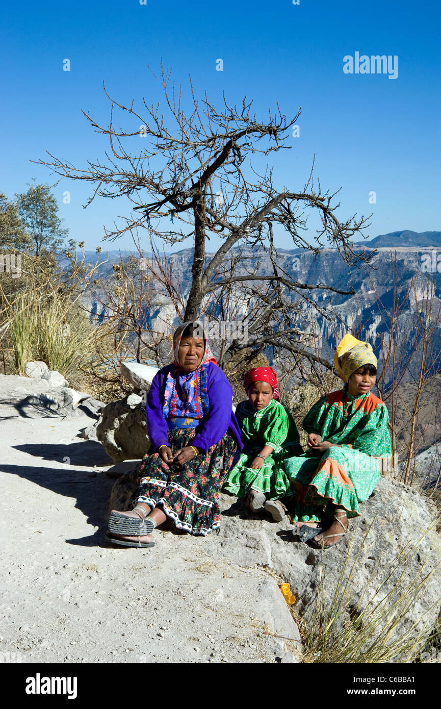 Native people in traditional dress at Copper Canyon's edge in Mexico ...
