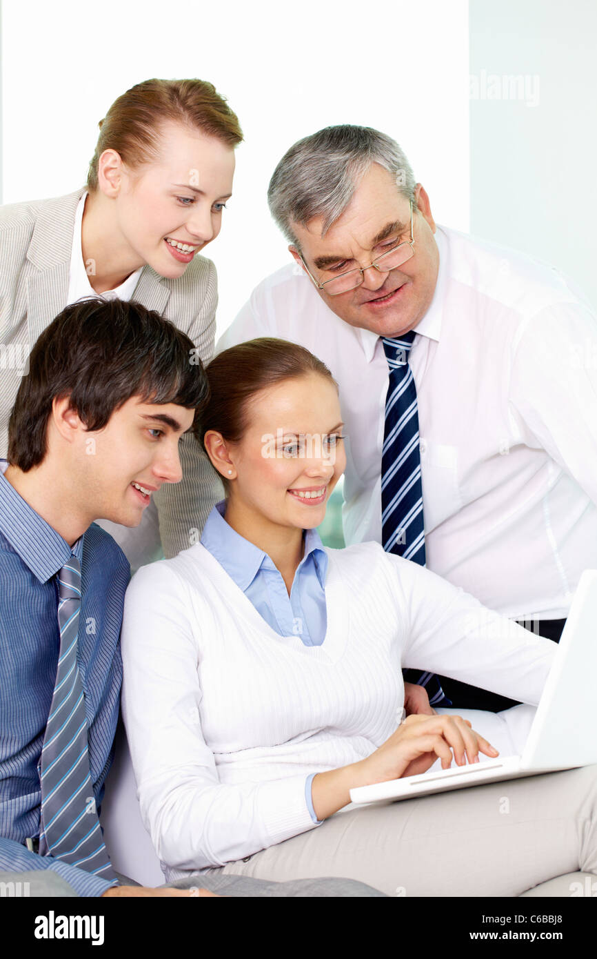 Portrait of several colleagues working through internet in office Stock ...