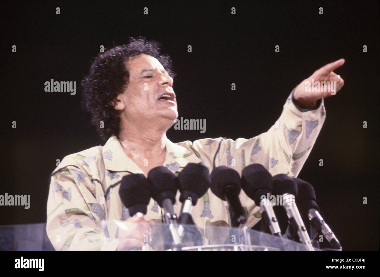 Muammar Gaddafi delivers a speech as fresh water flows into the ...