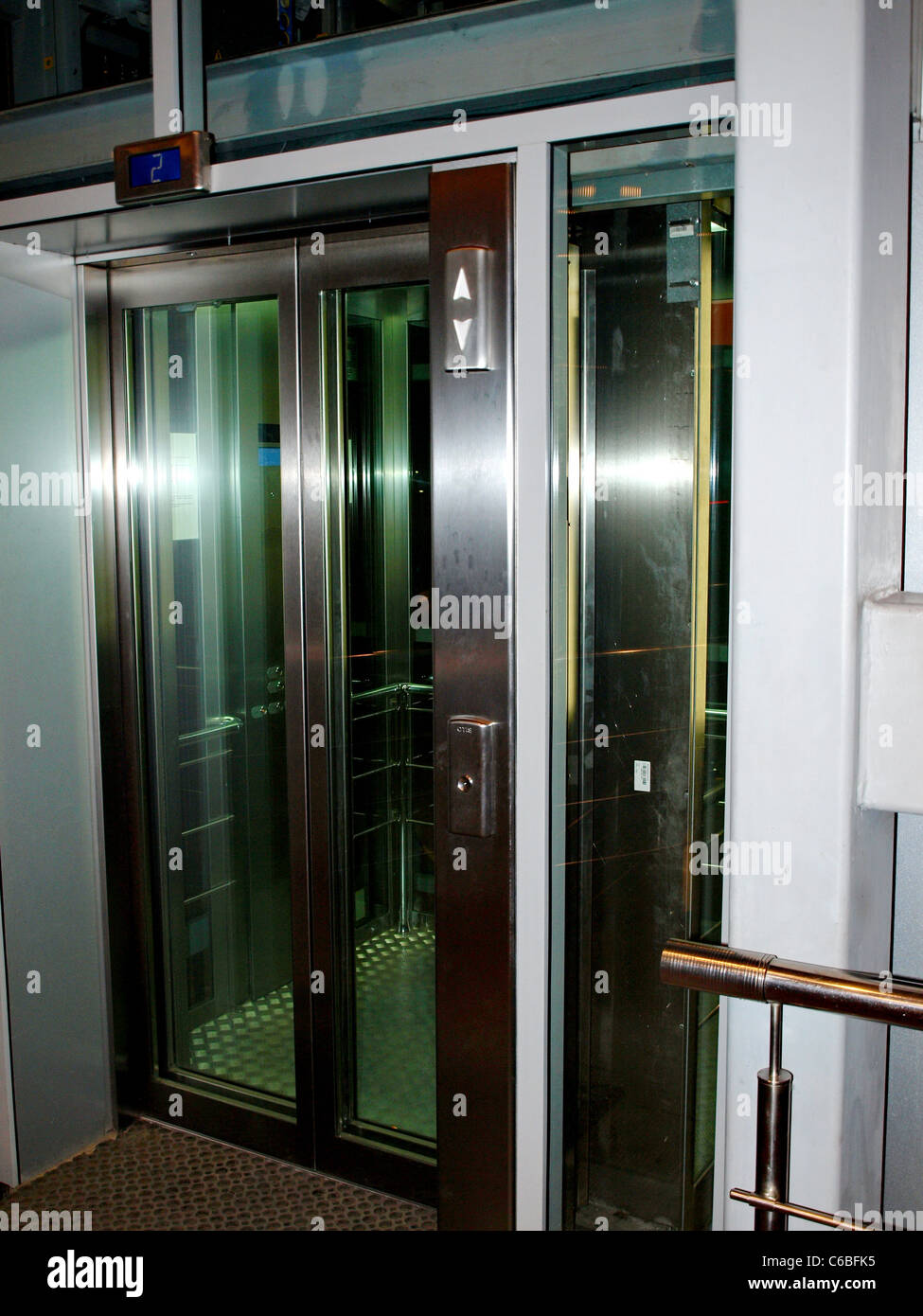 modern glass city elevator Stock Photo - Alamy