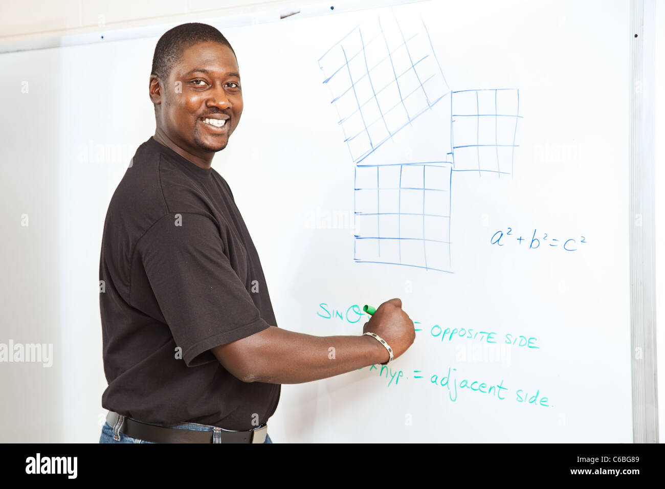 Handsome African-American college student (or teacher) doing ...