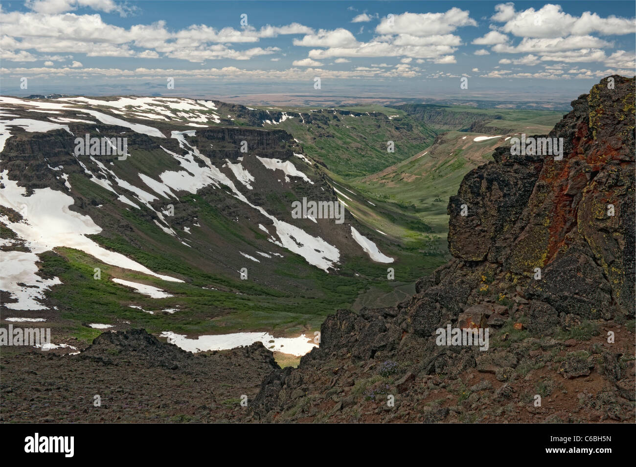 Lichen covered basalt overlooks this spectacular view of Little Blitzen ...