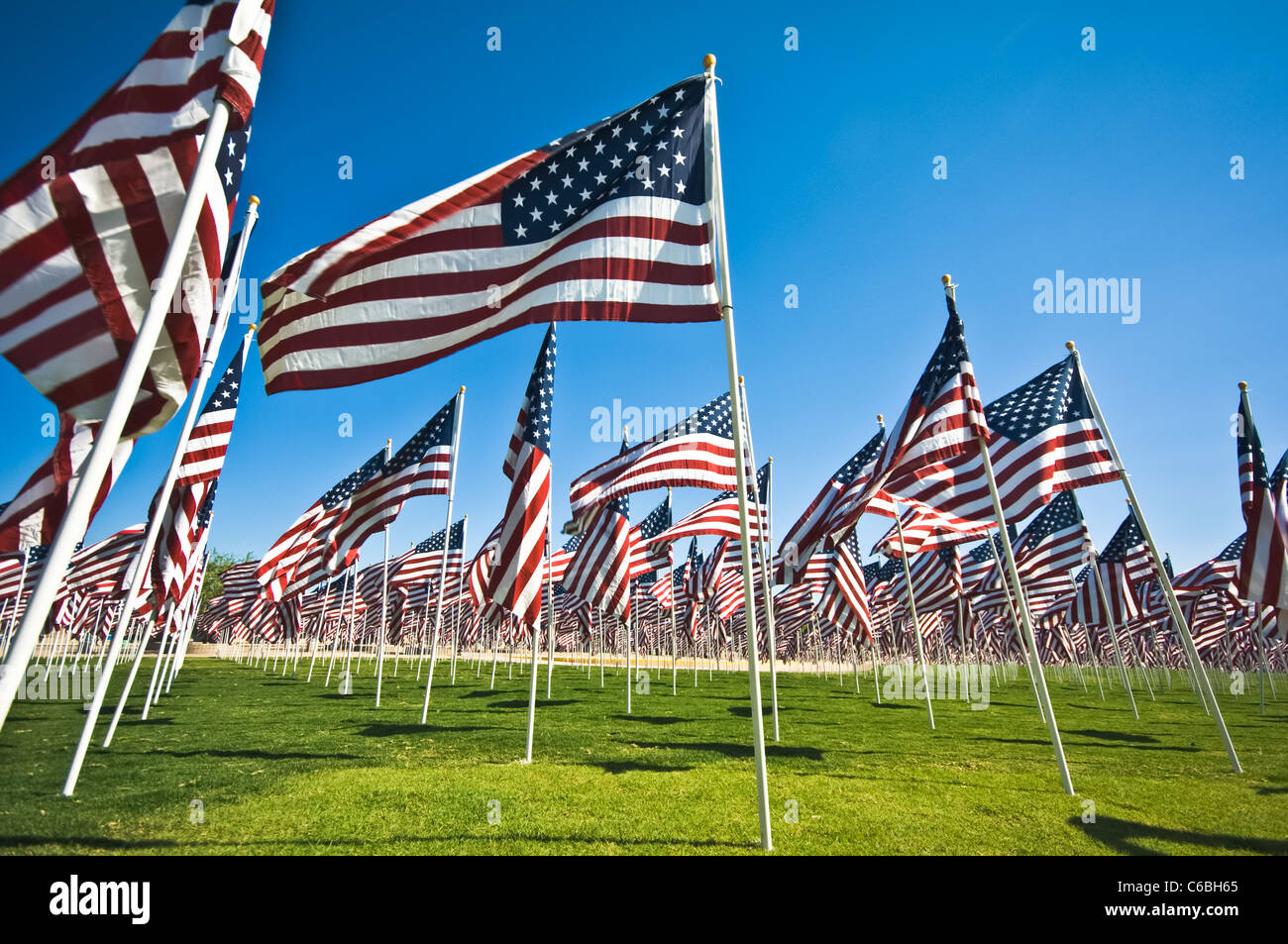 Hundreds of U.S.A. flags set up for a 911 program at Tempe Town Lake ...